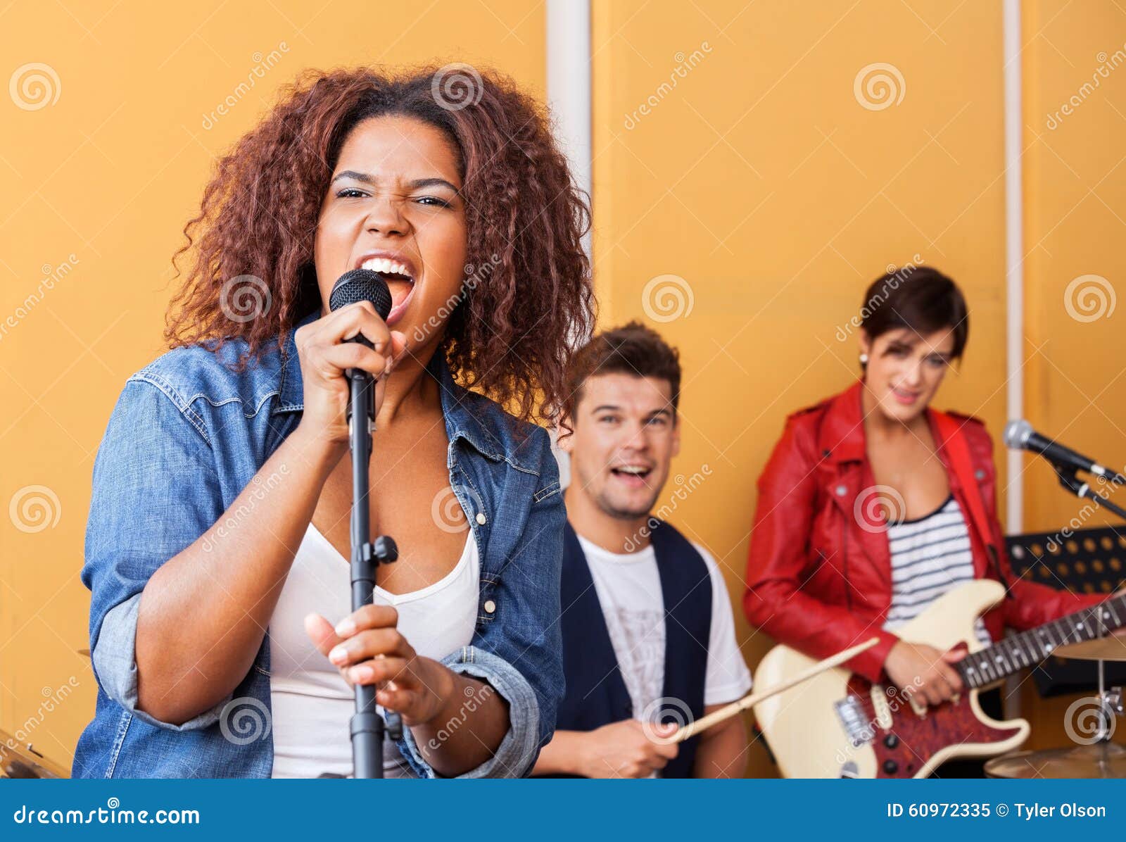 Female Singer Performing with Band Members in Stock Image - Image of ...