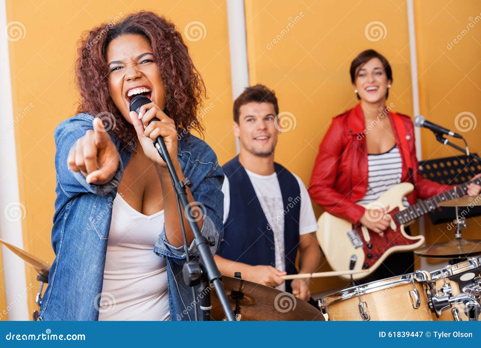 Female Singer Pointing while Performing in Stock Image - Image of ...