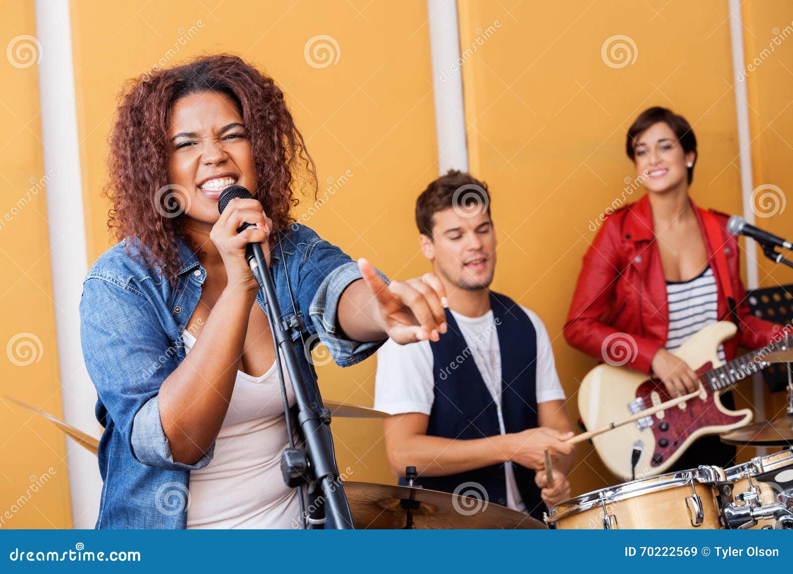 Female Singer Pointing while Performing in Recording Studio Stock Image ...
