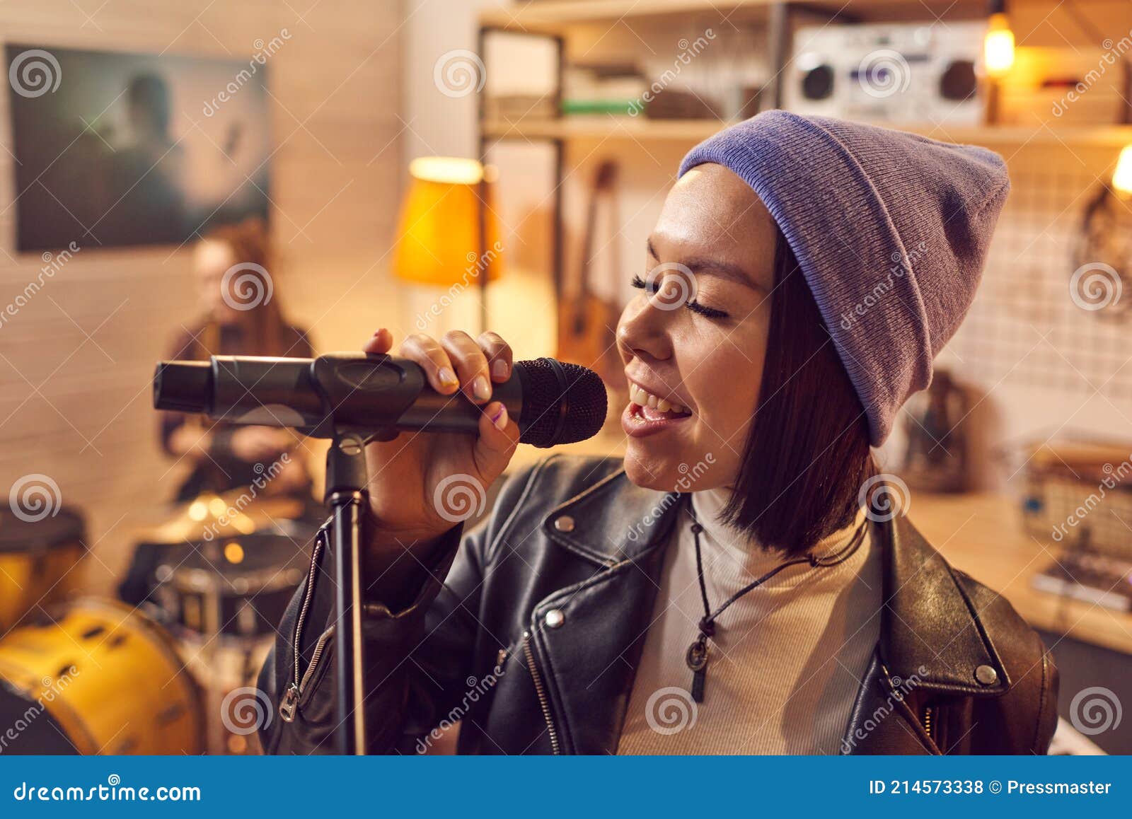 Female Singer Singing in Microphone Stock Photo - Image of cheerful ...