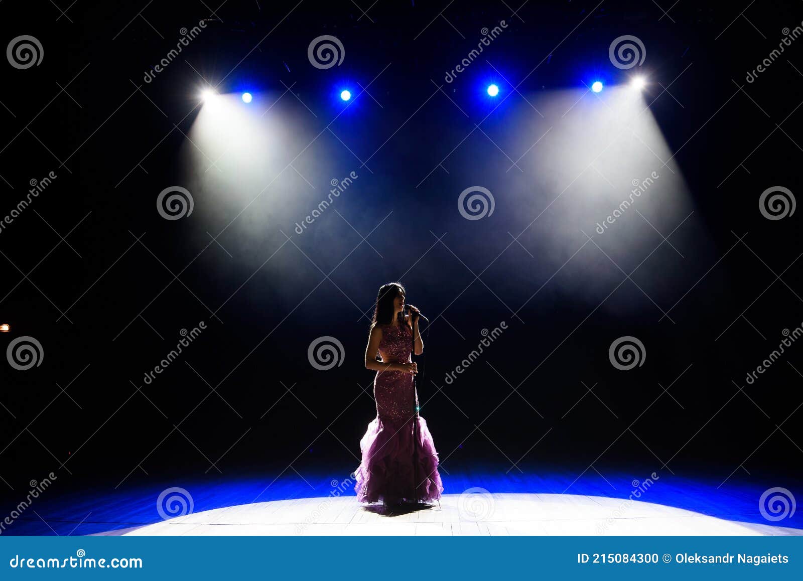 Female Singer on the Stage Holding a Microphone. Stock Photo - Image of ...