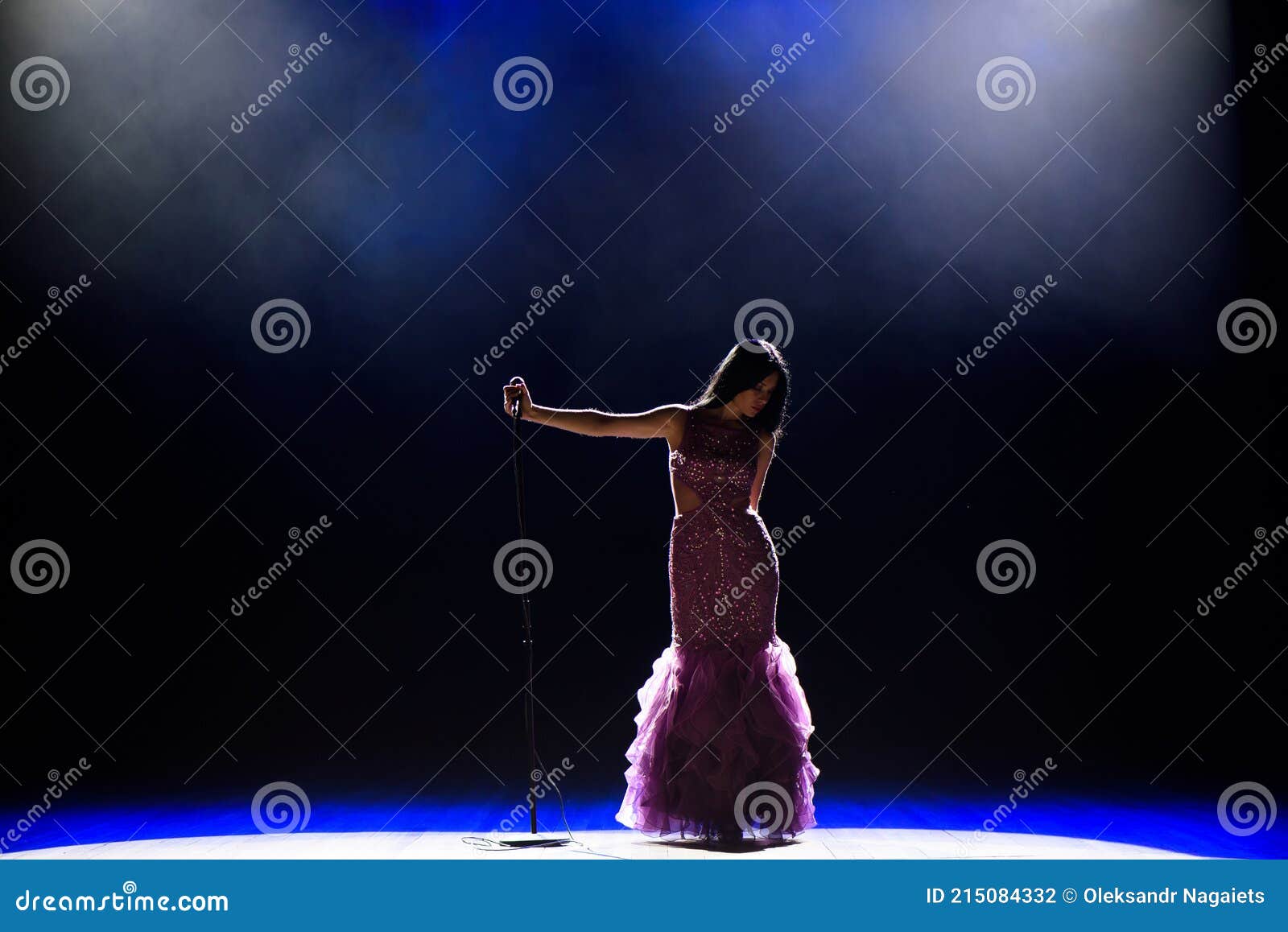 Female Singer on the Stage Holding a Microphone. Stock Photo - Image of ...