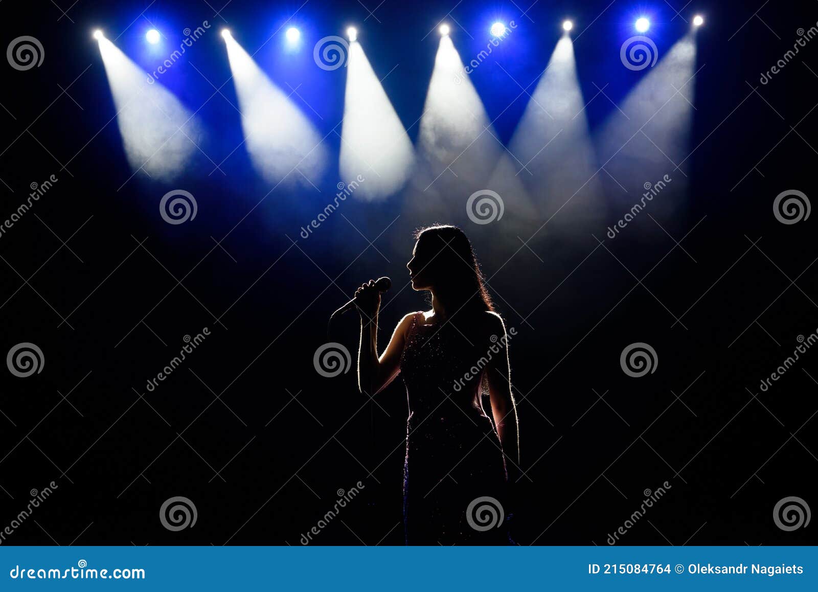 Female Singer on the Stage Holding a Microphone. Stock Photo - Image of ...
