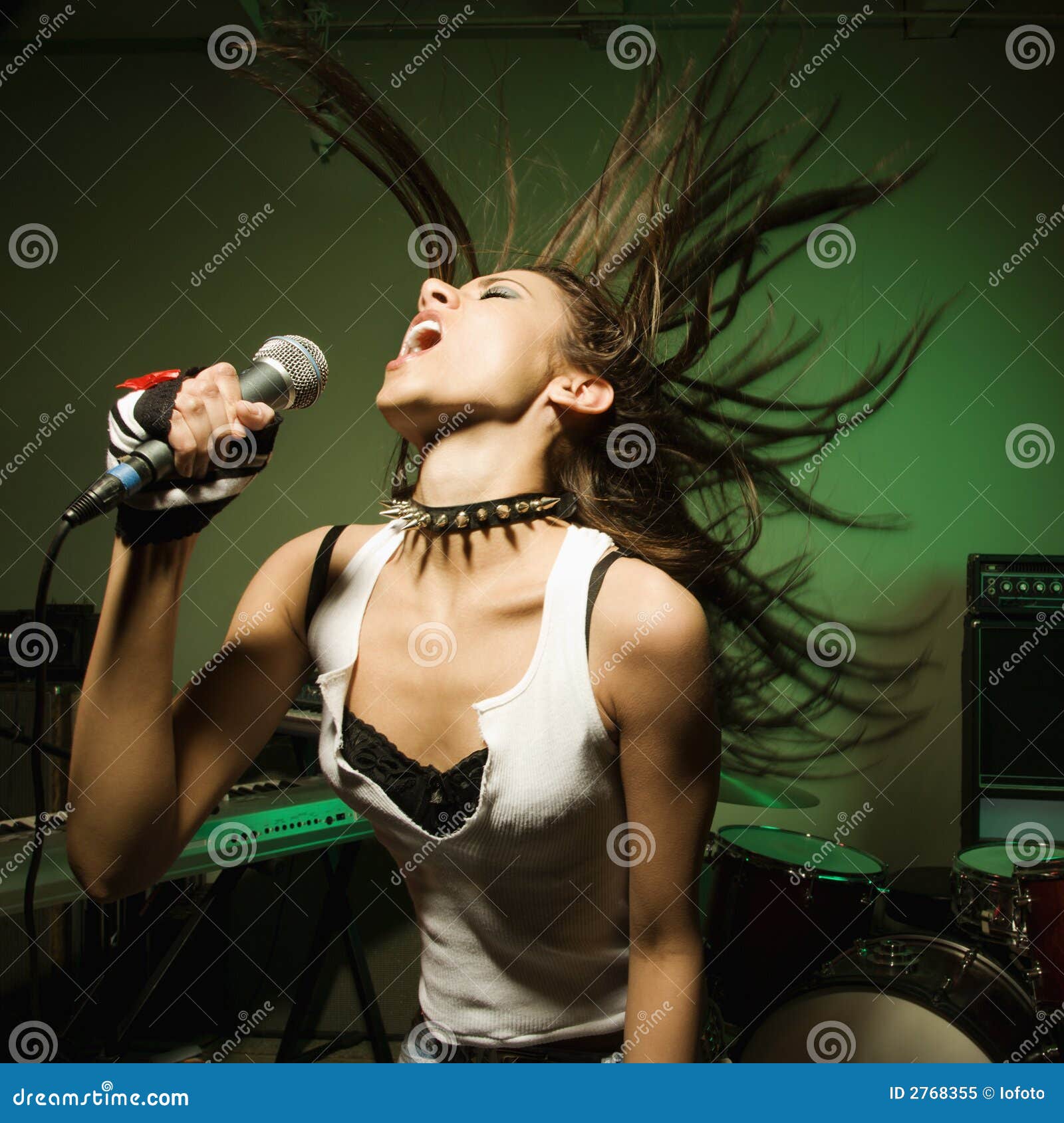Female singing into mic. stock image. Image of photograph - 2768355