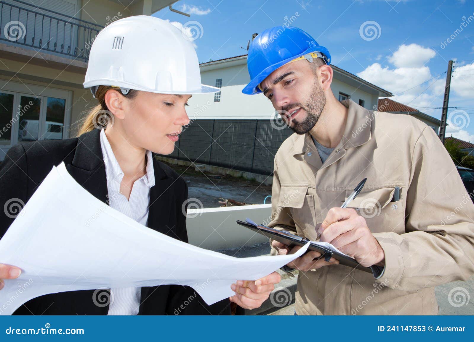 Female Site Manager with Worker Making Notes on Clipboard Stock Image ...