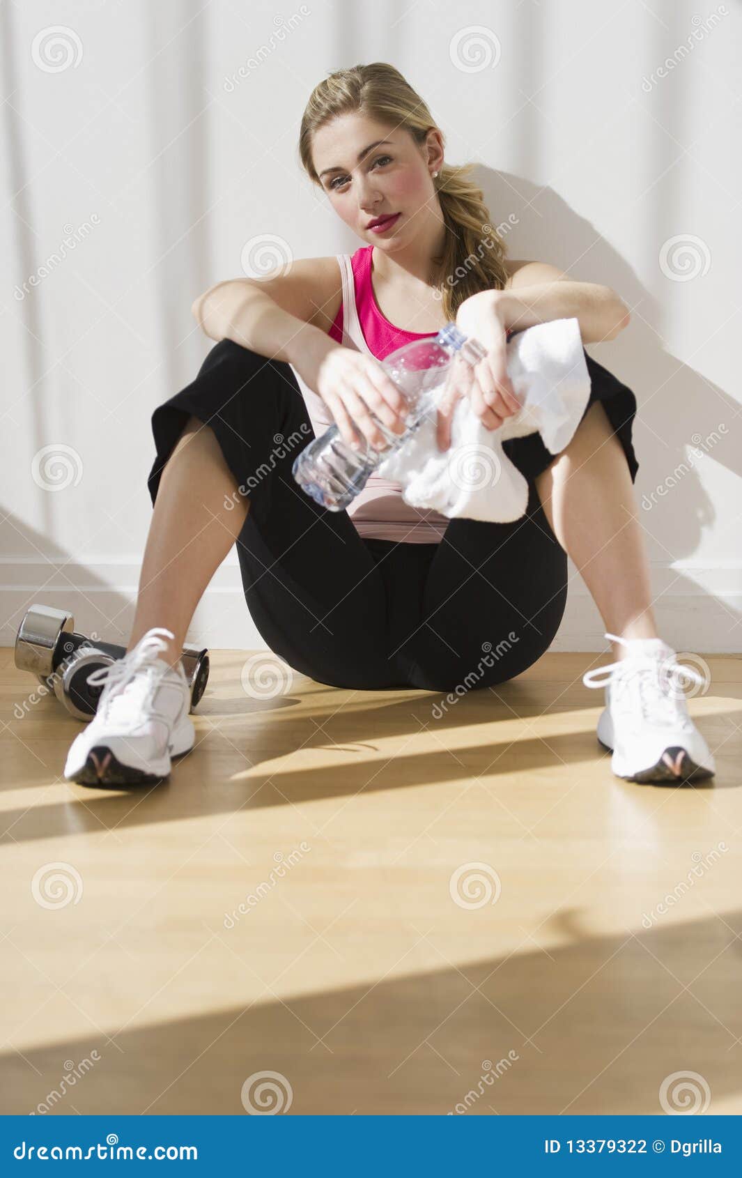 Female Sitting Against Wall in after Workout Stock Photo - Image of ...