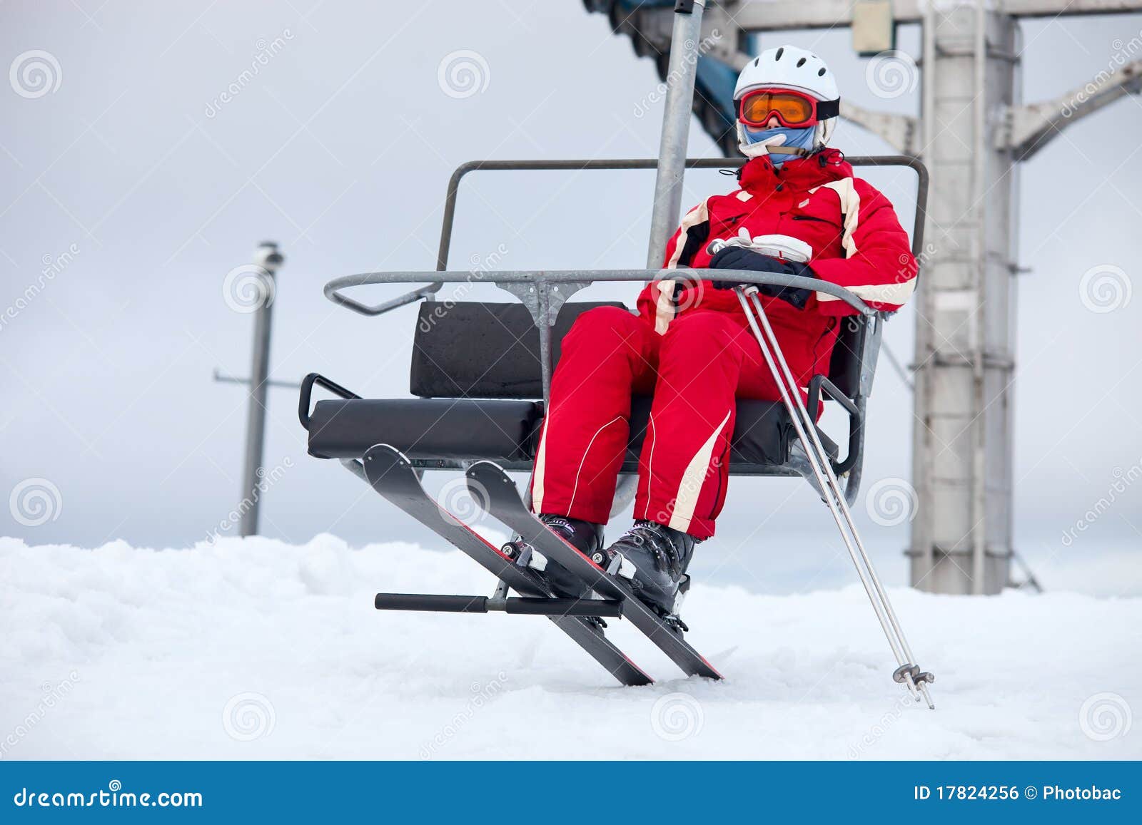 Female skier on chair-lift stock photo. Image of person - 17824256