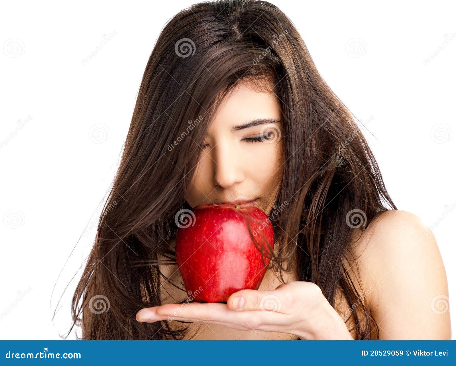 Female smelling red apple stock image. Image of food - 20529059