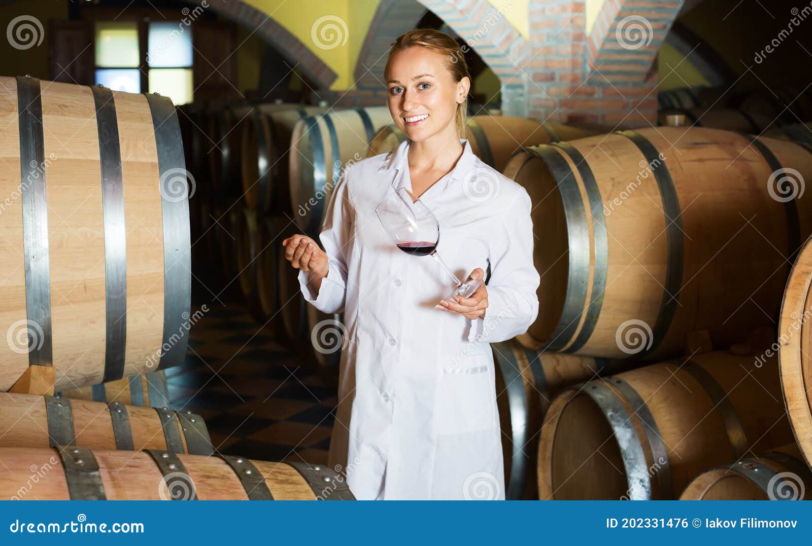 Female Sommelier in Wine Cellar Stock Photo - Image of people, robe ...