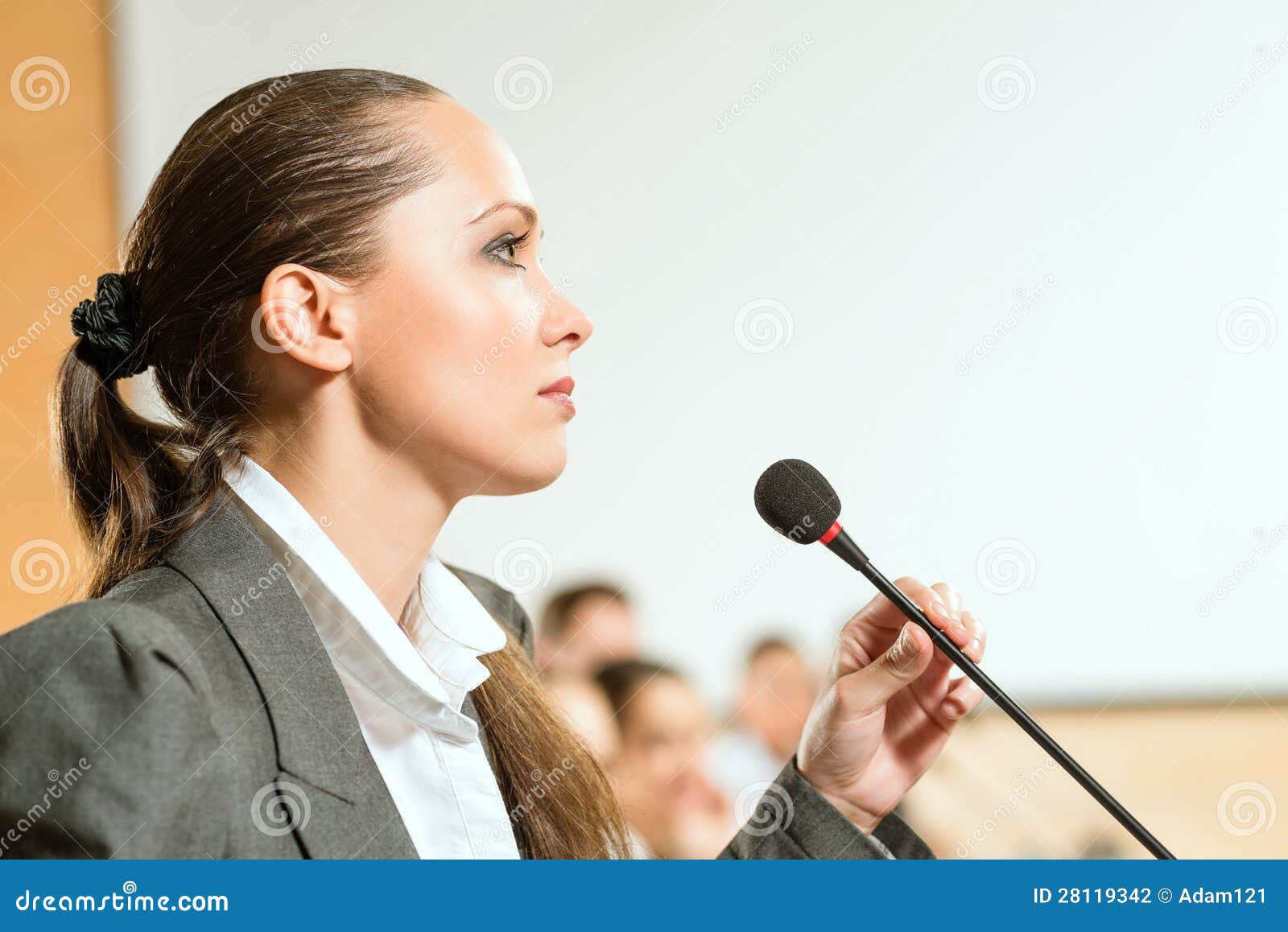 Female Speaker Giving Presentation In Hall At Workshop. Audience Or ...