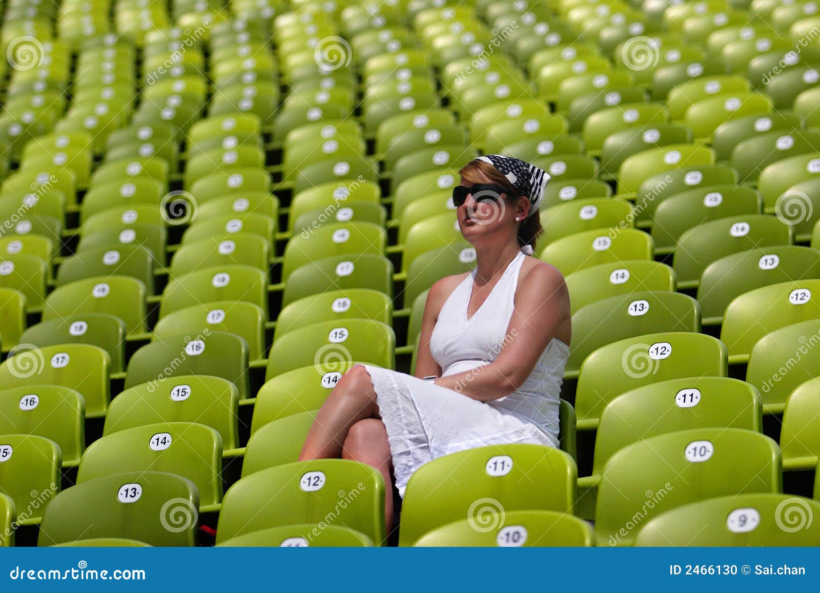 A Female Spectator in the Sun Stock Photo - Image of bleachers, numbers ...