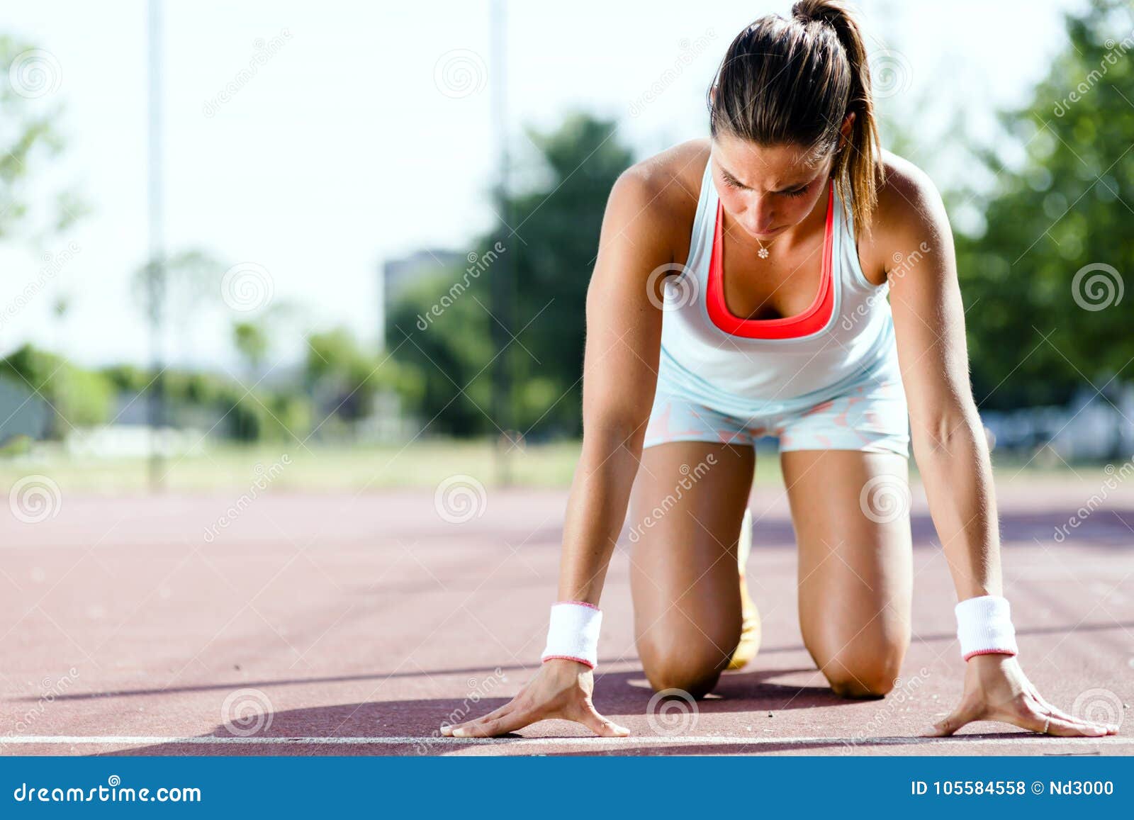 Female Sprinter Getting Ready for the Run Stock Photo - Image of pose ...