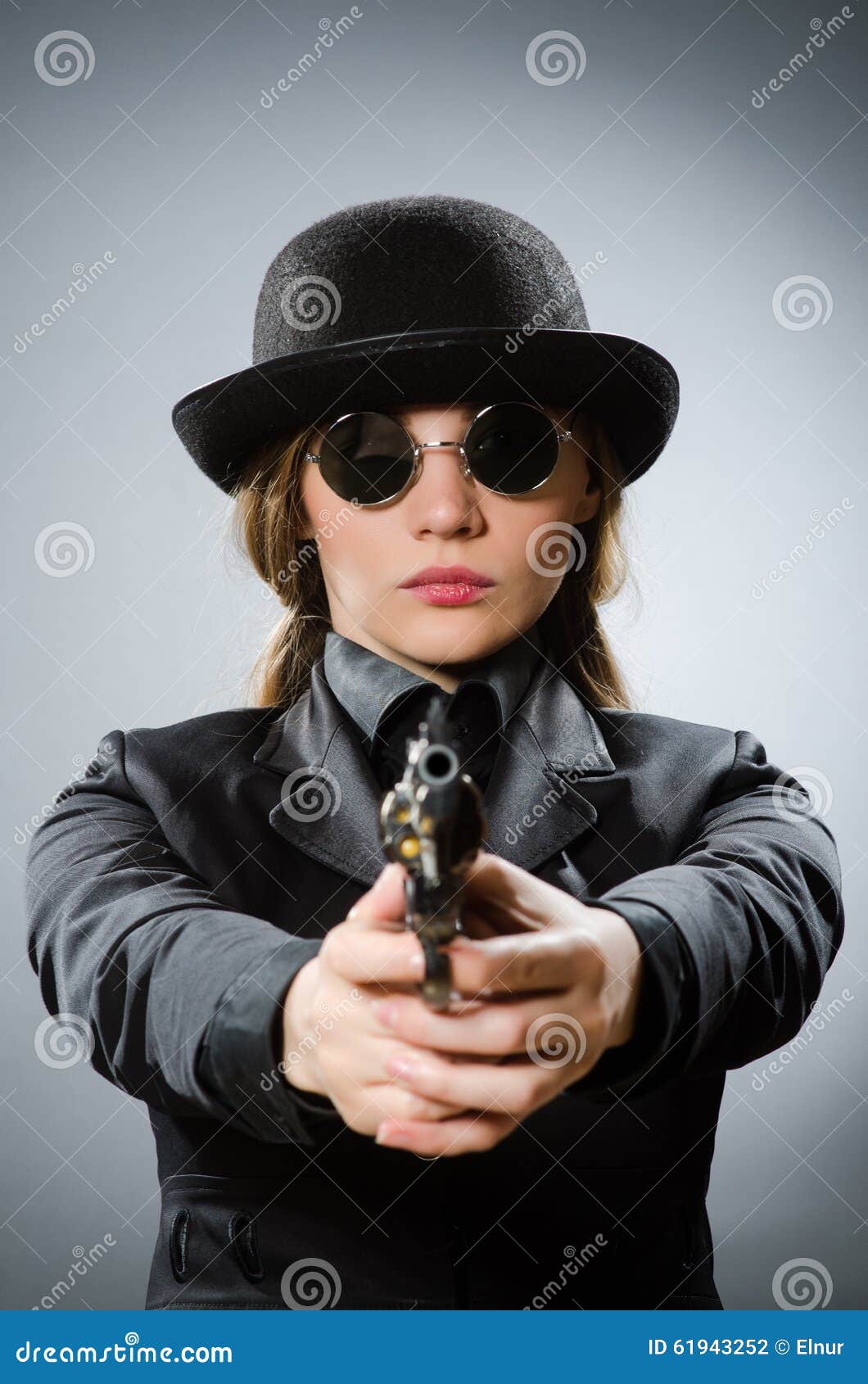 The Female Spy with Weapon Against Gray Stock Photo - Image of ...