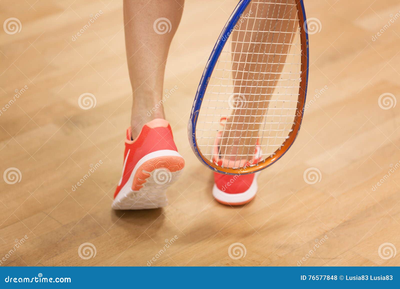 Female Squash Player Hiting a Ball in a Squash Court Stock Photo ...
