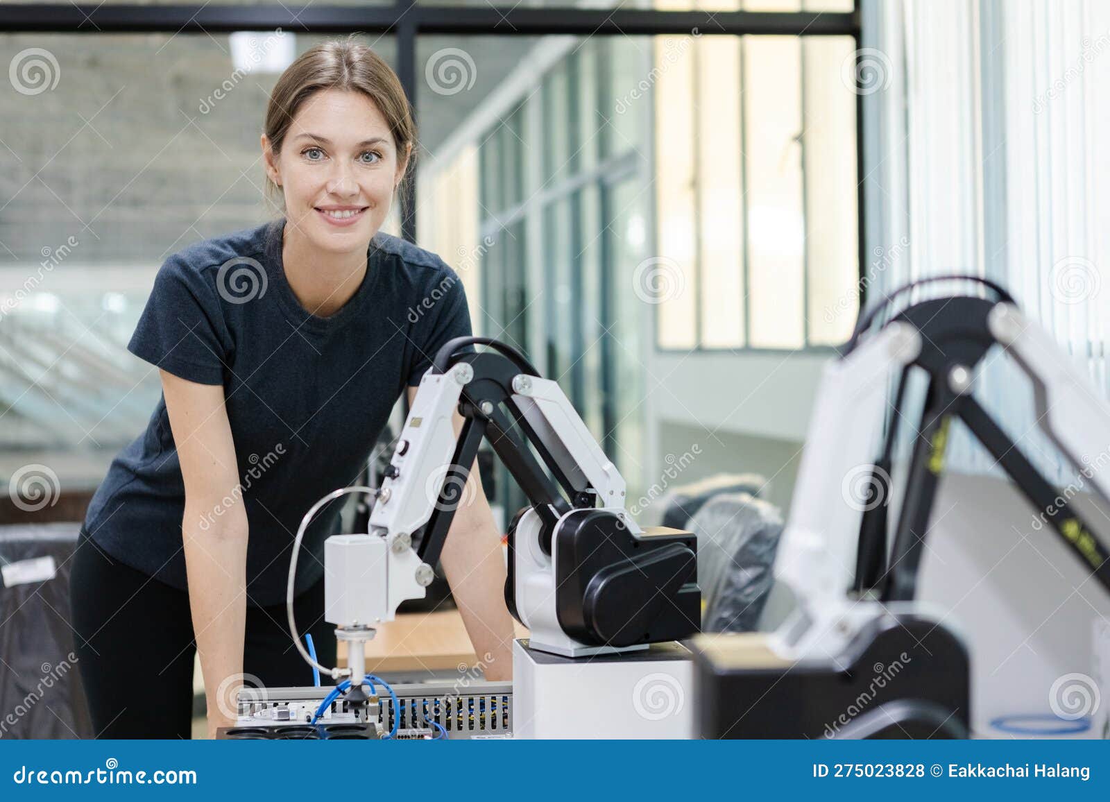 Female Staff Engineer with Robot for Education on Table at Class Room ...