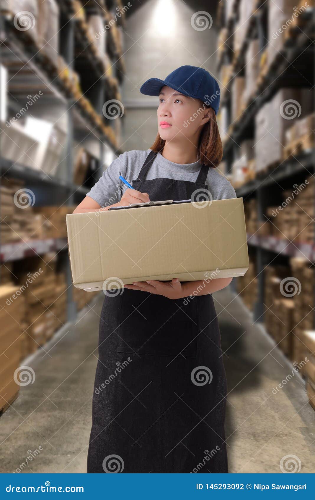 Female Staff Lifting Parcel Boxes in the Warehouse Stock Photo - Image ...