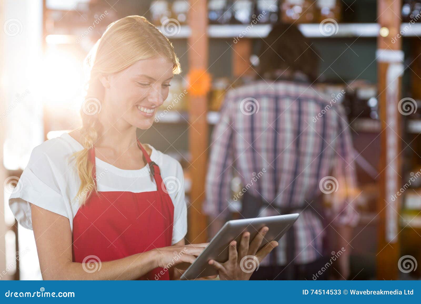 Female Staff Using Digital Tablet in Supermarket Stock Image - Image of ...