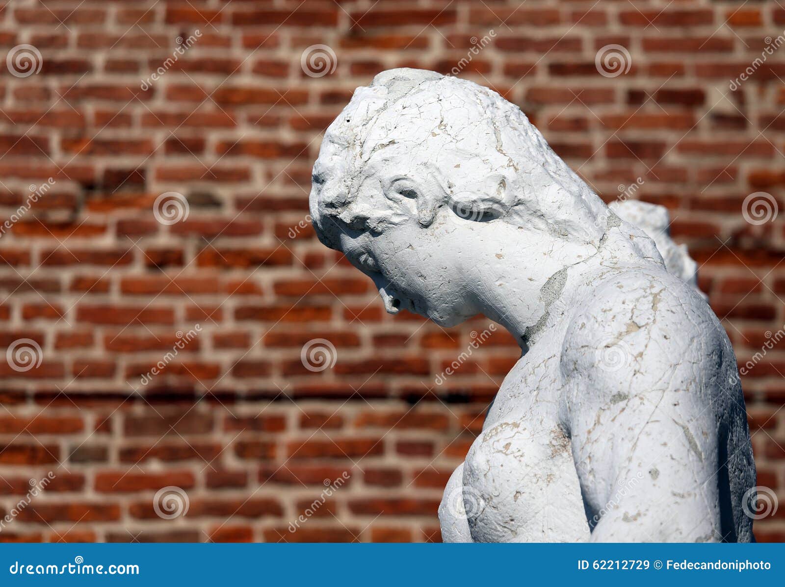 Female Statue with the Background Brick Wall Stock Image - Image of ...