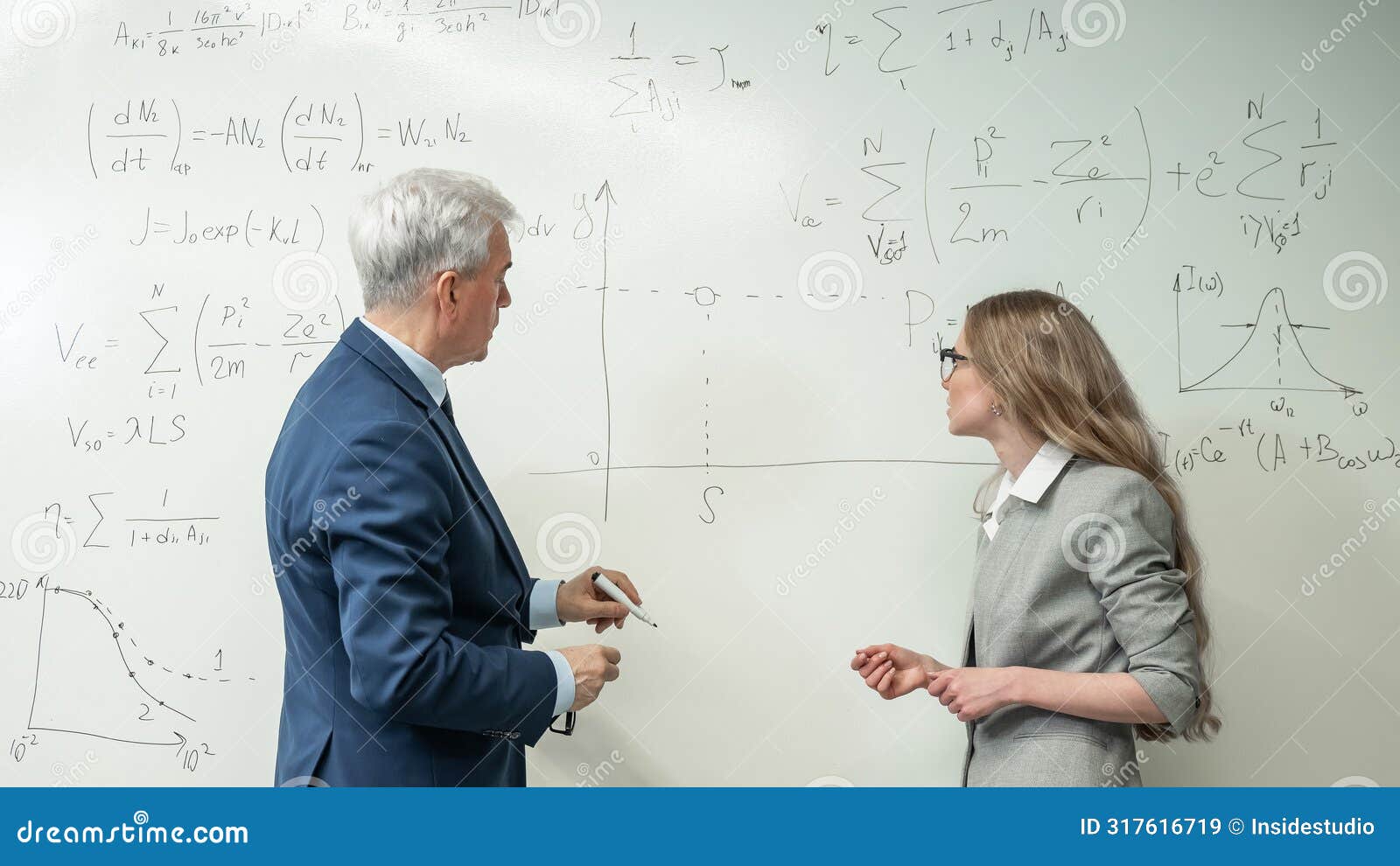 Female Student Answers a Question from an Elderly Professor at a White ...