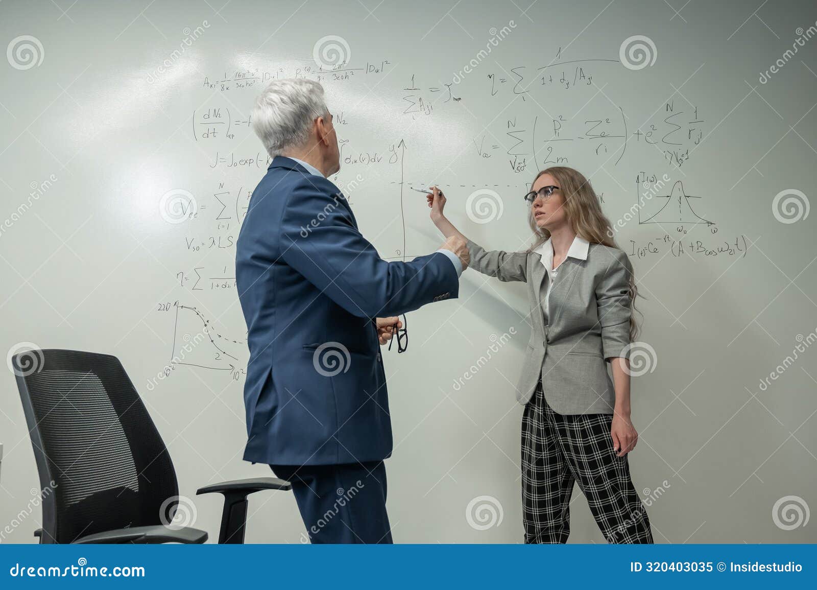 Female Student Answers a Question from an Elderly Professor at a White ...