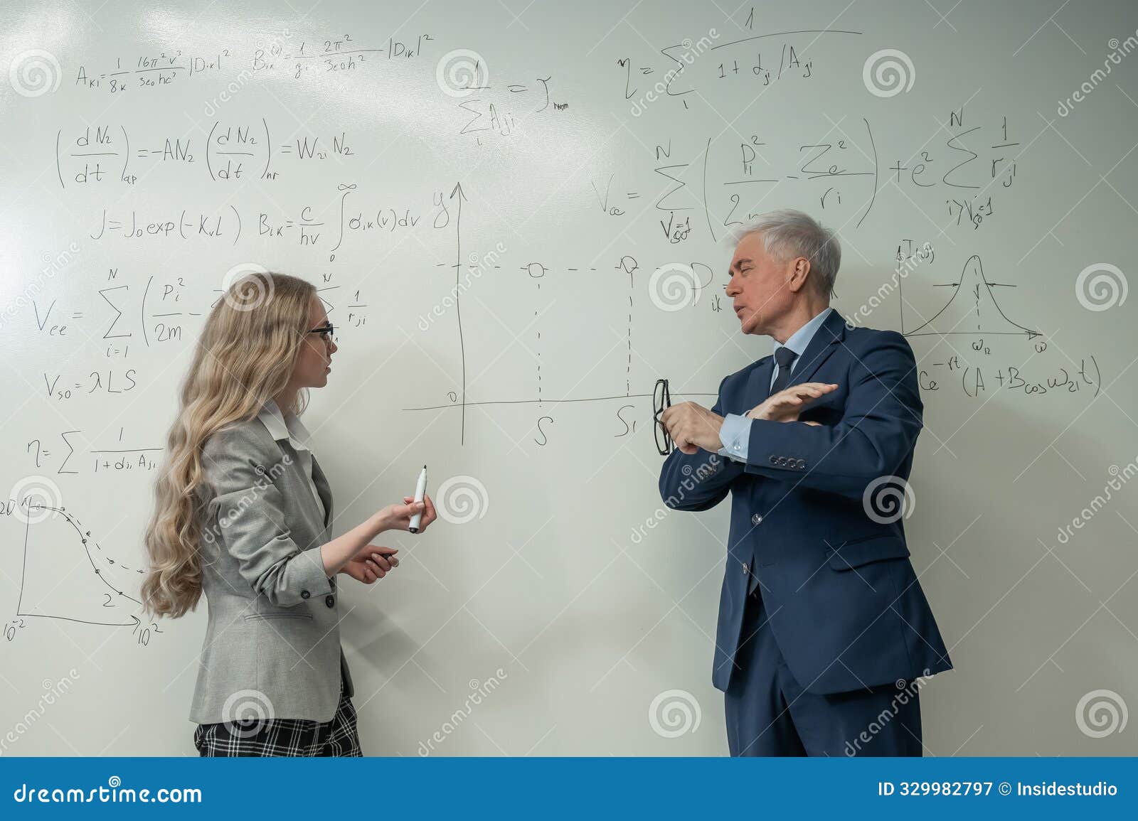 Female Student Answers a Question from an Elderly Professor at a White ...