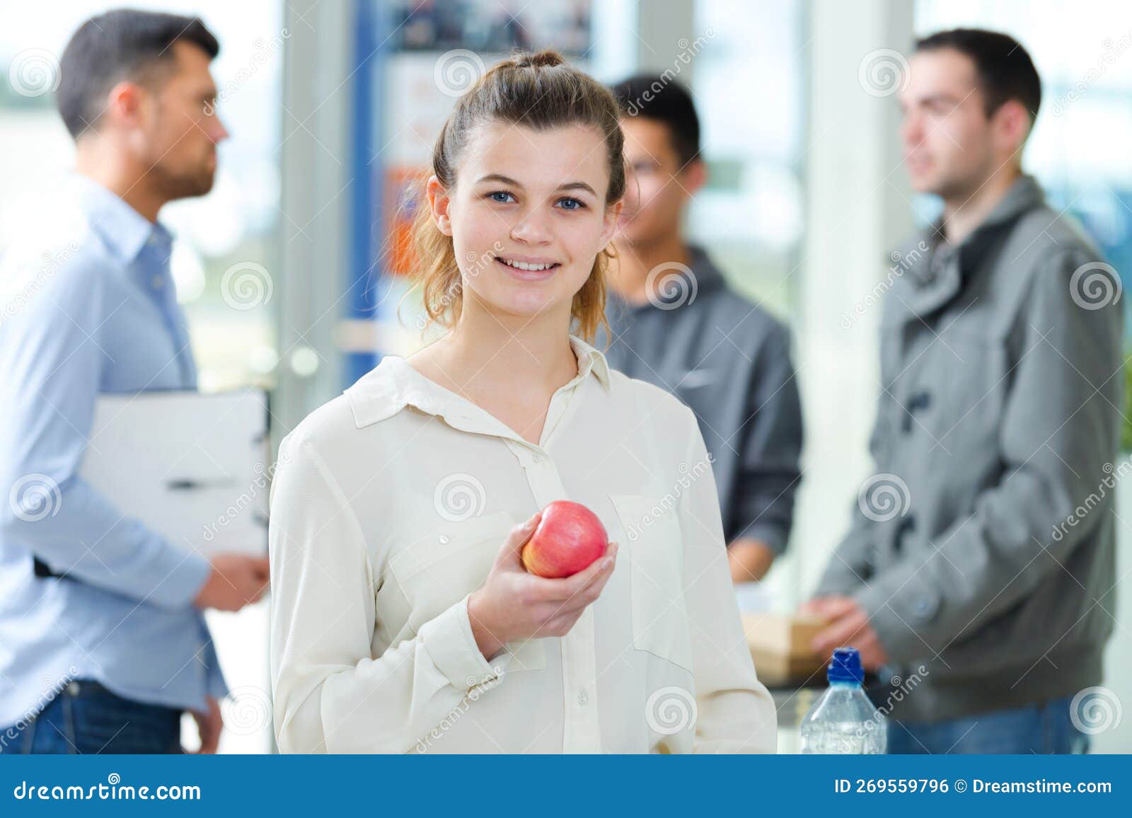 Female student with apple stock photo. Image of education - 269559796