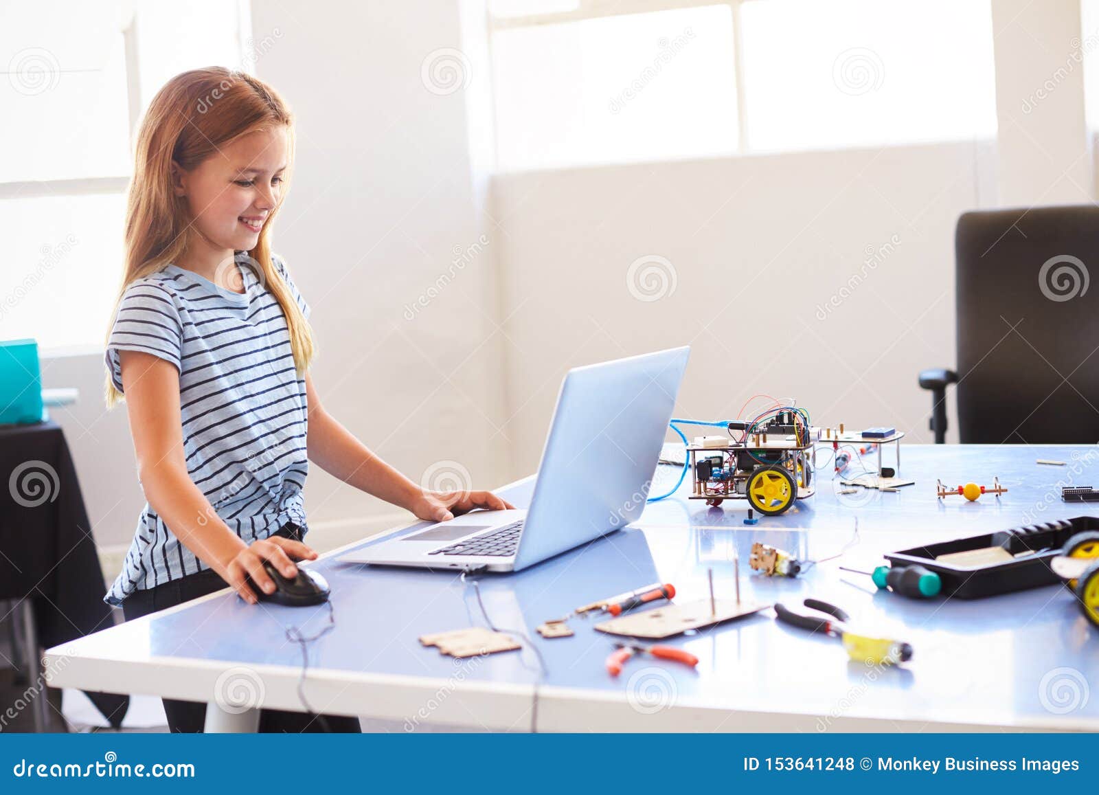Female Student Building and Programing Robot Vehicle in after School ...