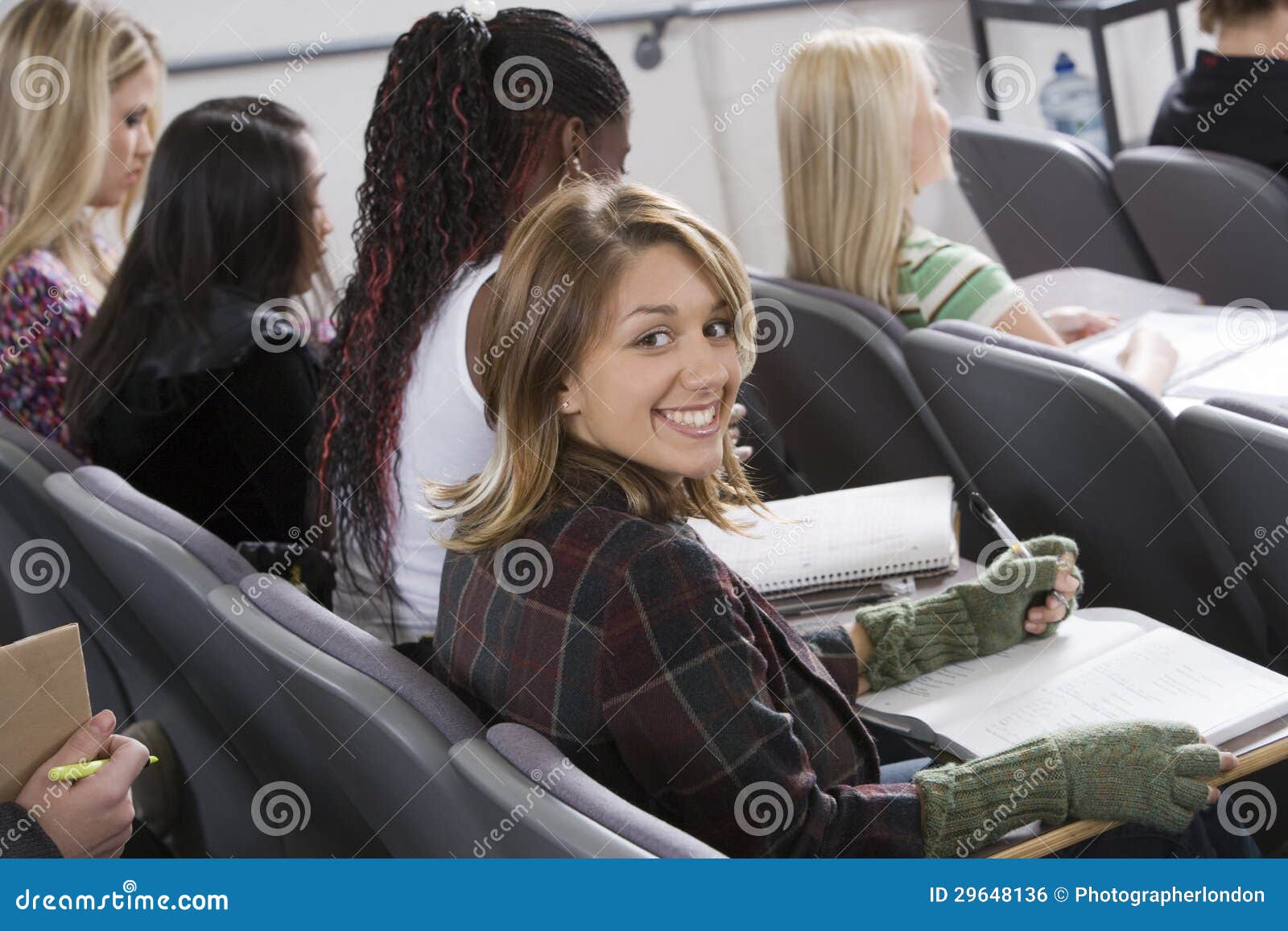 Female Student with Classmates in College Stock Photo - Image of ...