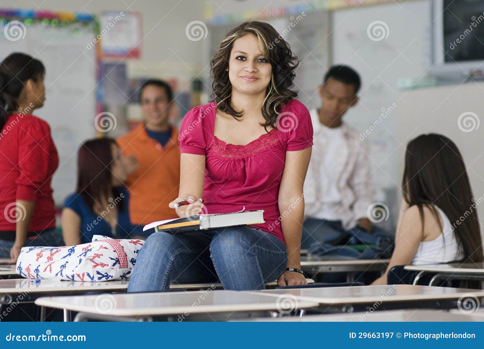 Female Student in Classroom with Friends Stock Image - Image of ...