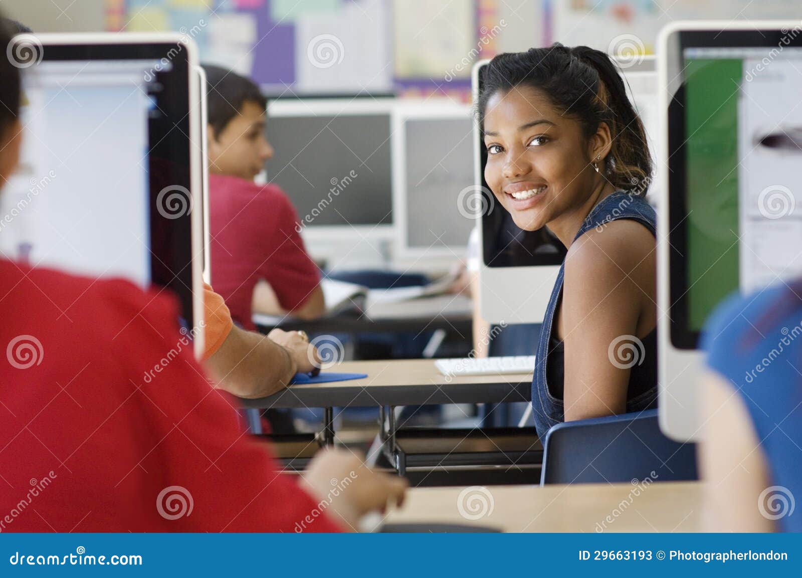 Female Student in Computer Laboratory with Classmates Stock Image ...
