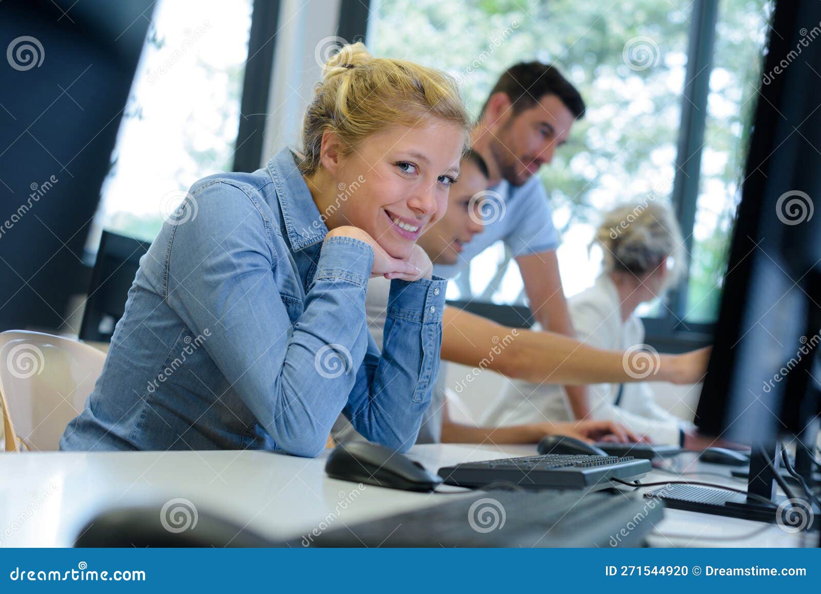 Female Student in Computer Room Smiling at Camera Stock Photo - Image ...
