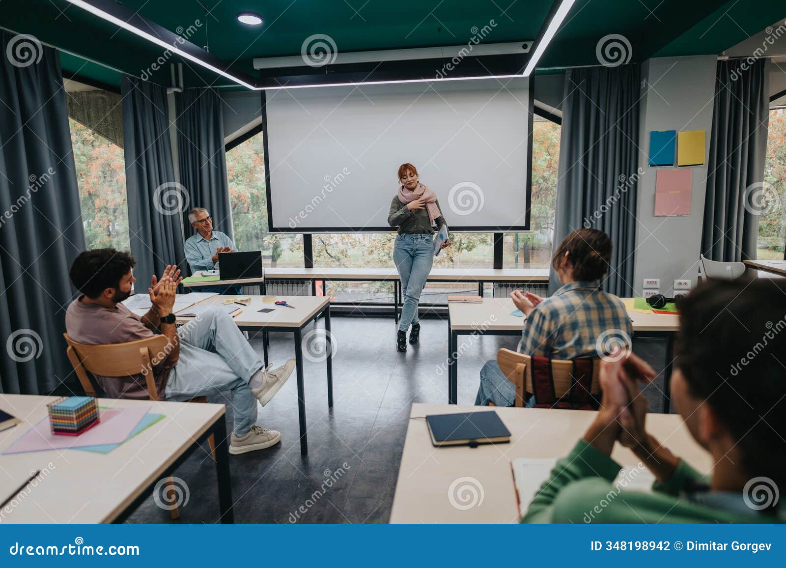 Female Student Delivering a Project Presentation in Classroom Setting ...