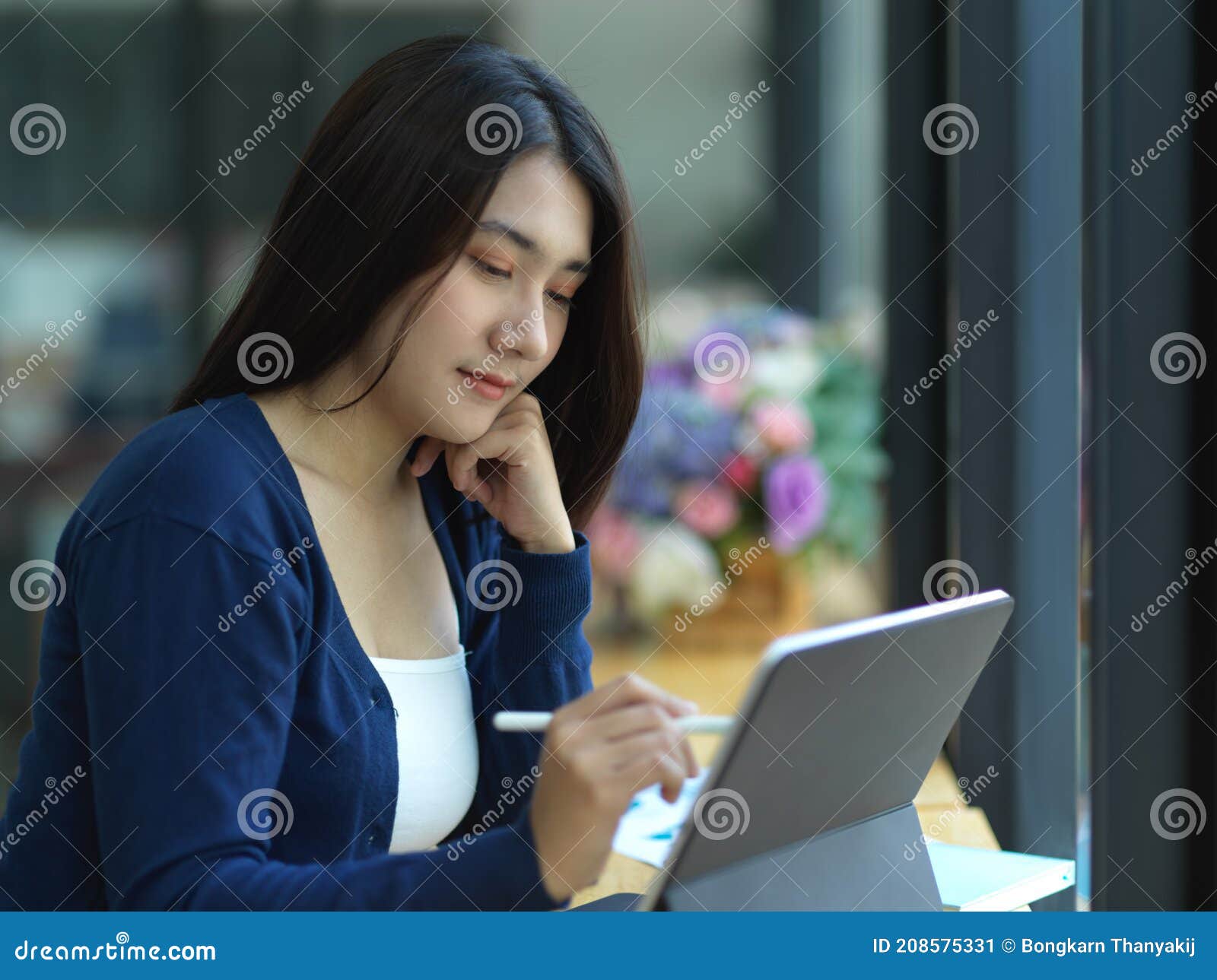 Female Student Doing Assignment with Tablet on Wooden Bar in Cafe Stock ...