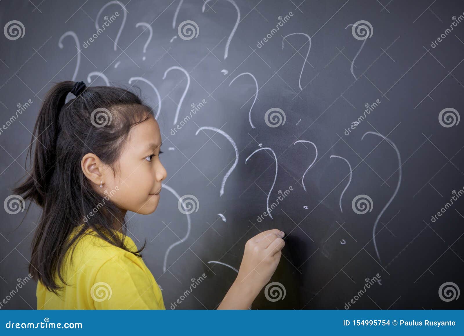 Female Student Drawing Question Marks in Classroom Stock Photo - Image ...