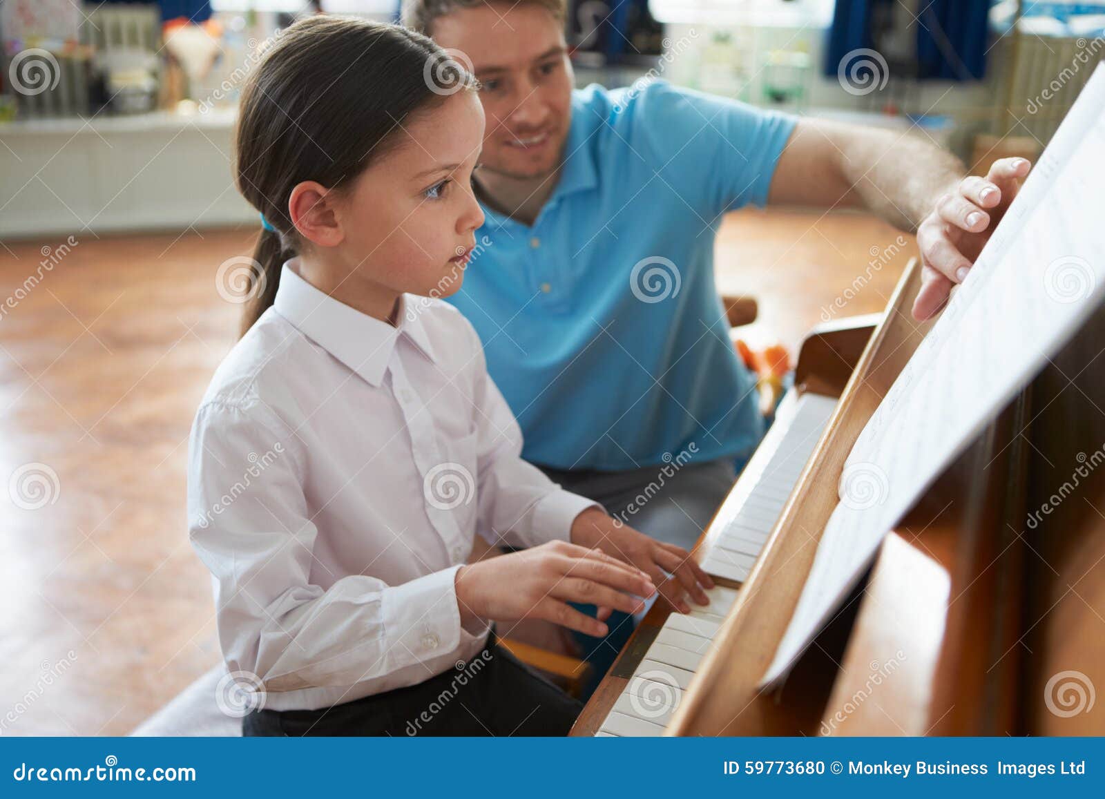 Female Student Enjoying Piano Lesson with Teacher Stock Photo - Image ...