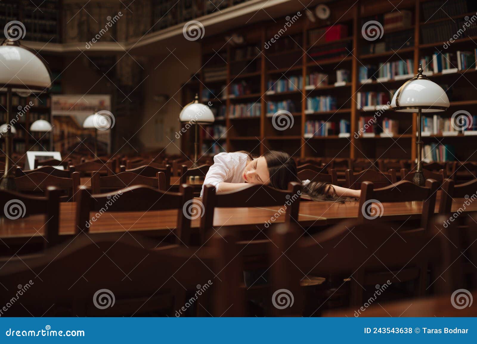 Female Student Fell Asleep Reading a Book in a Public Library, Lying on ...
