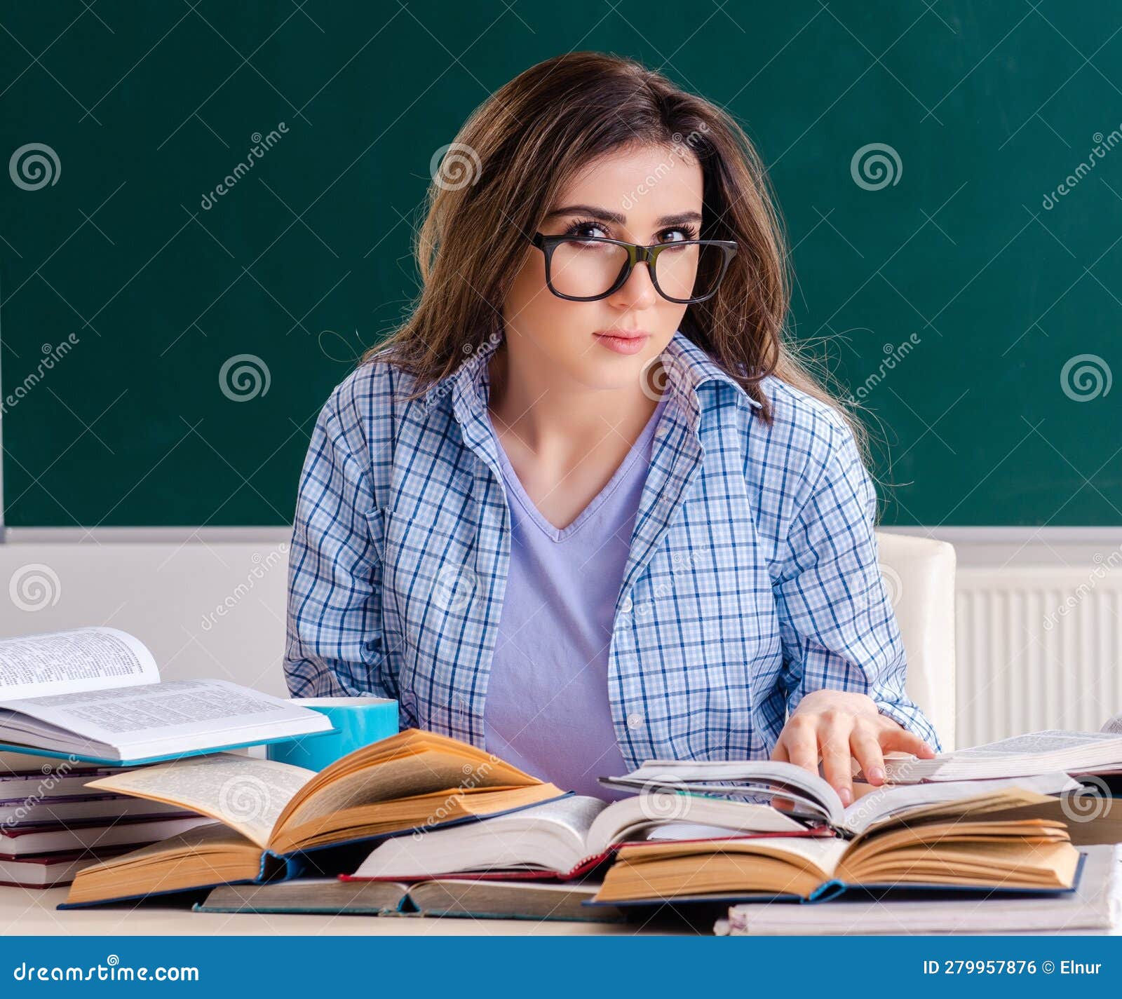 Female Student in Front of Chalkboard Stock Photo - Image of book ...