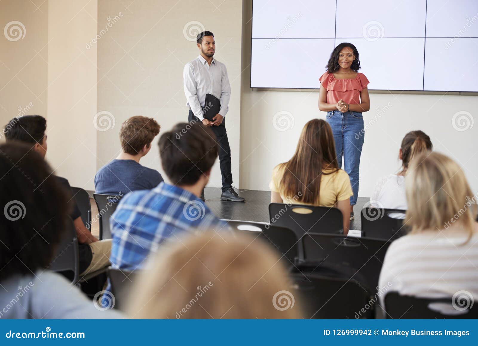 Female Student Giving Presentation To High School Class in Front of ...