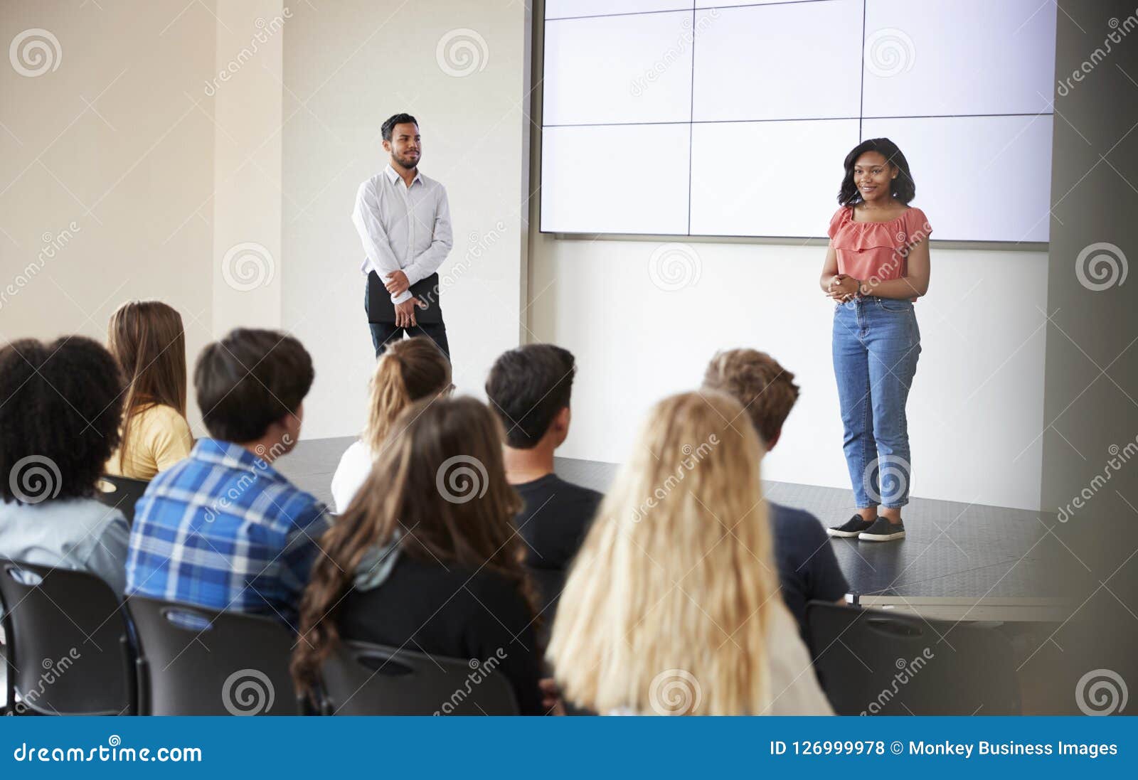 Female Student Giving Presentation To High School Class in Front of ...