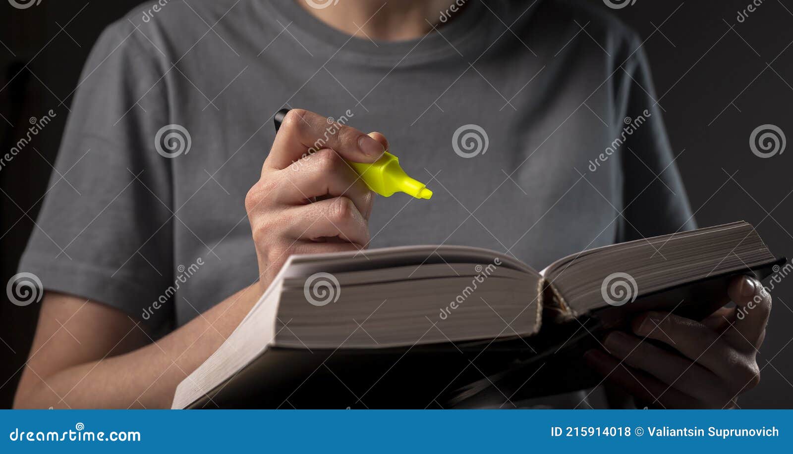 Female Student Hands Holding Yellow Highlighter and Reading Book or ...