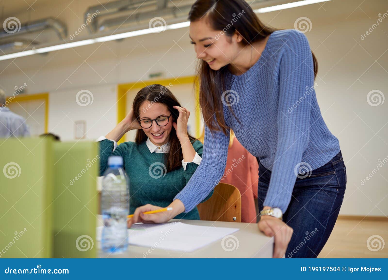 Female Student Helping Female Colleague about the Lesson Stock Photo ...