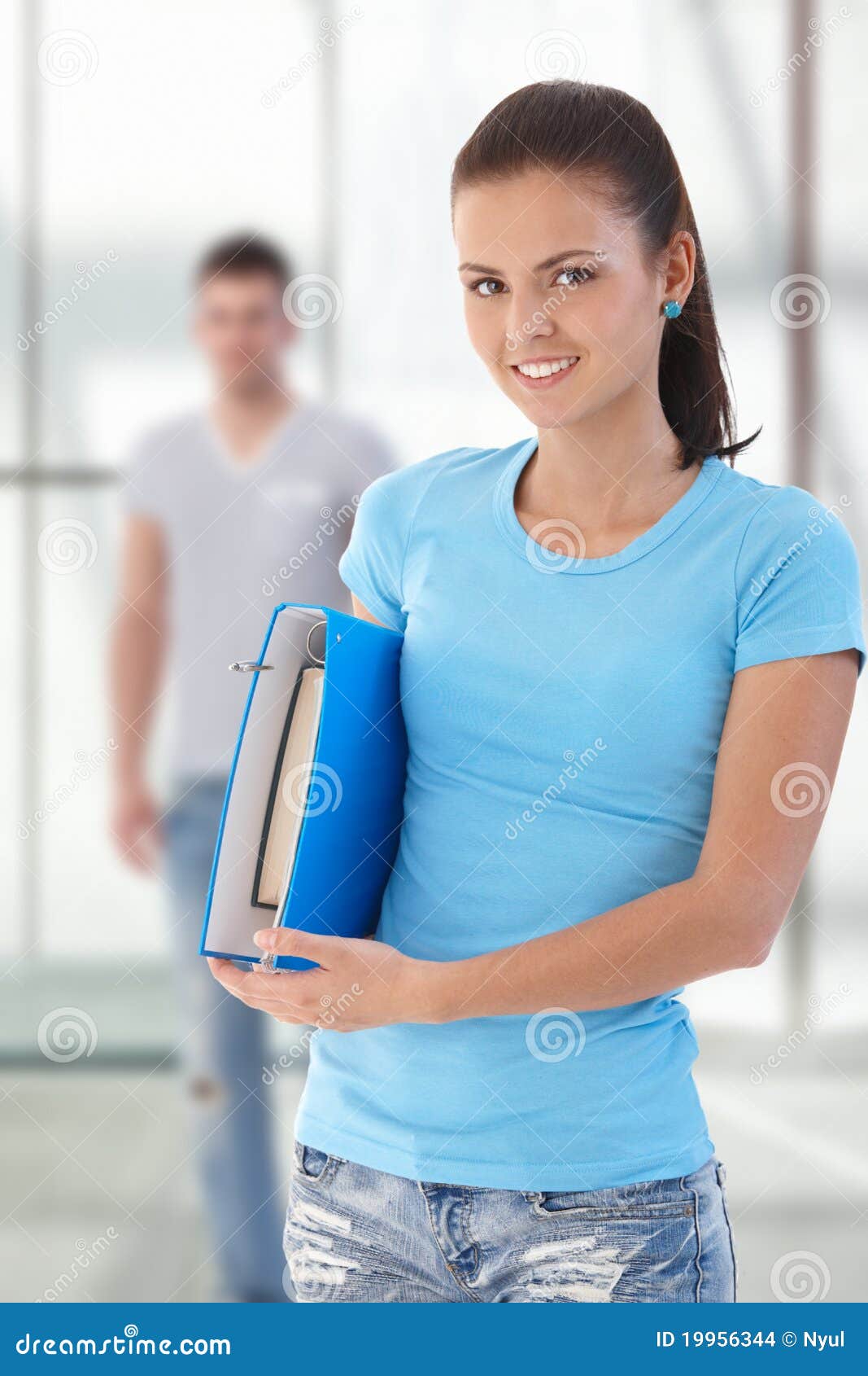 Female Student Holding Folder Stock Photo - Image of corridor ...