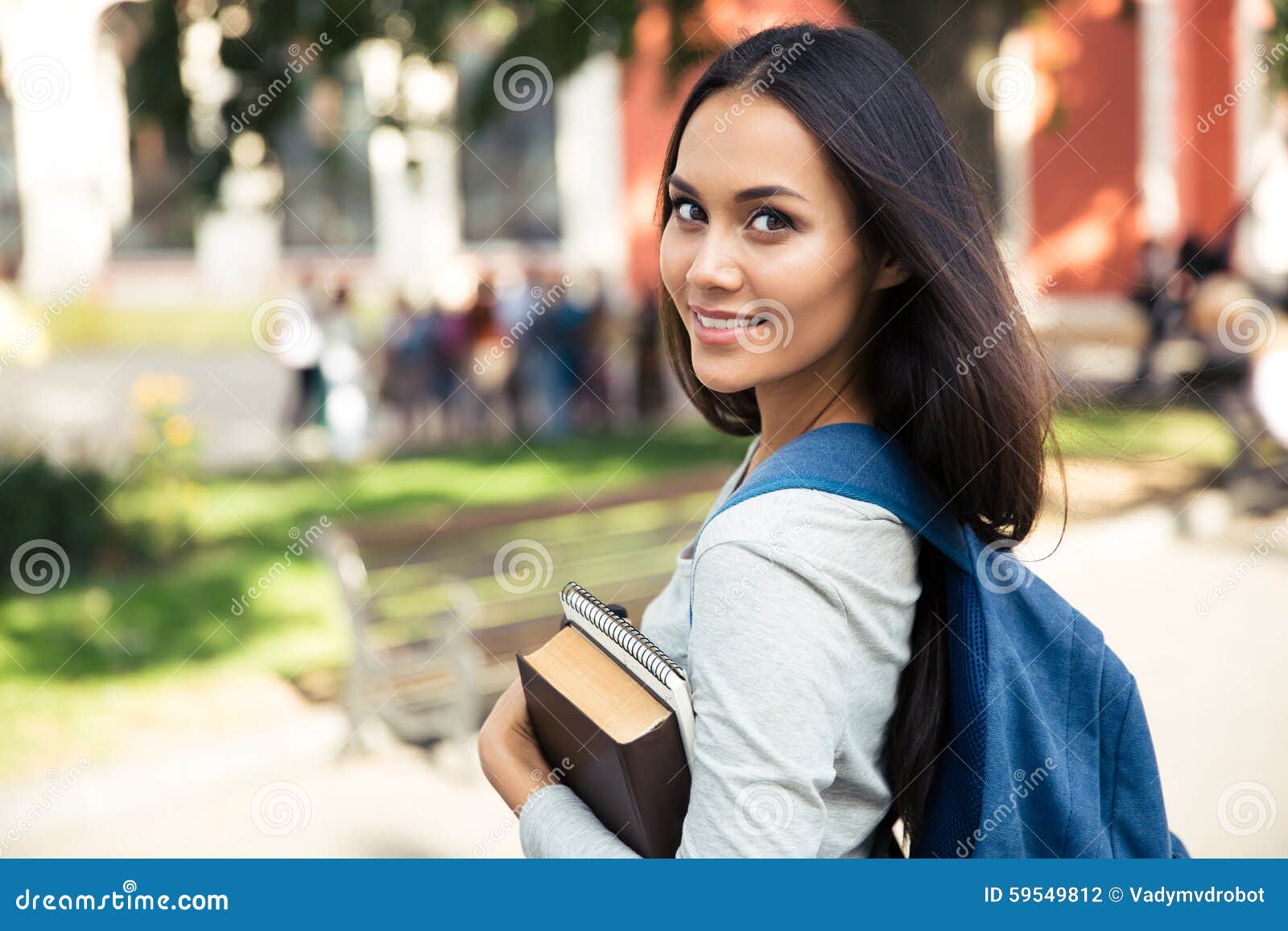 Female Student Looking Back at Camera Stock Photo - Image of girl ...