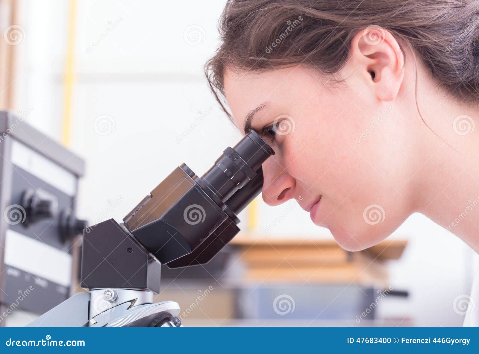 Female Student Looking into the Microscope Stock Photo - Image of ...