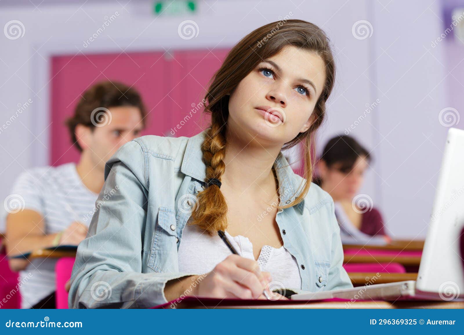 Female Student Looking at Notes and Laptop Stock Image - Image of ...