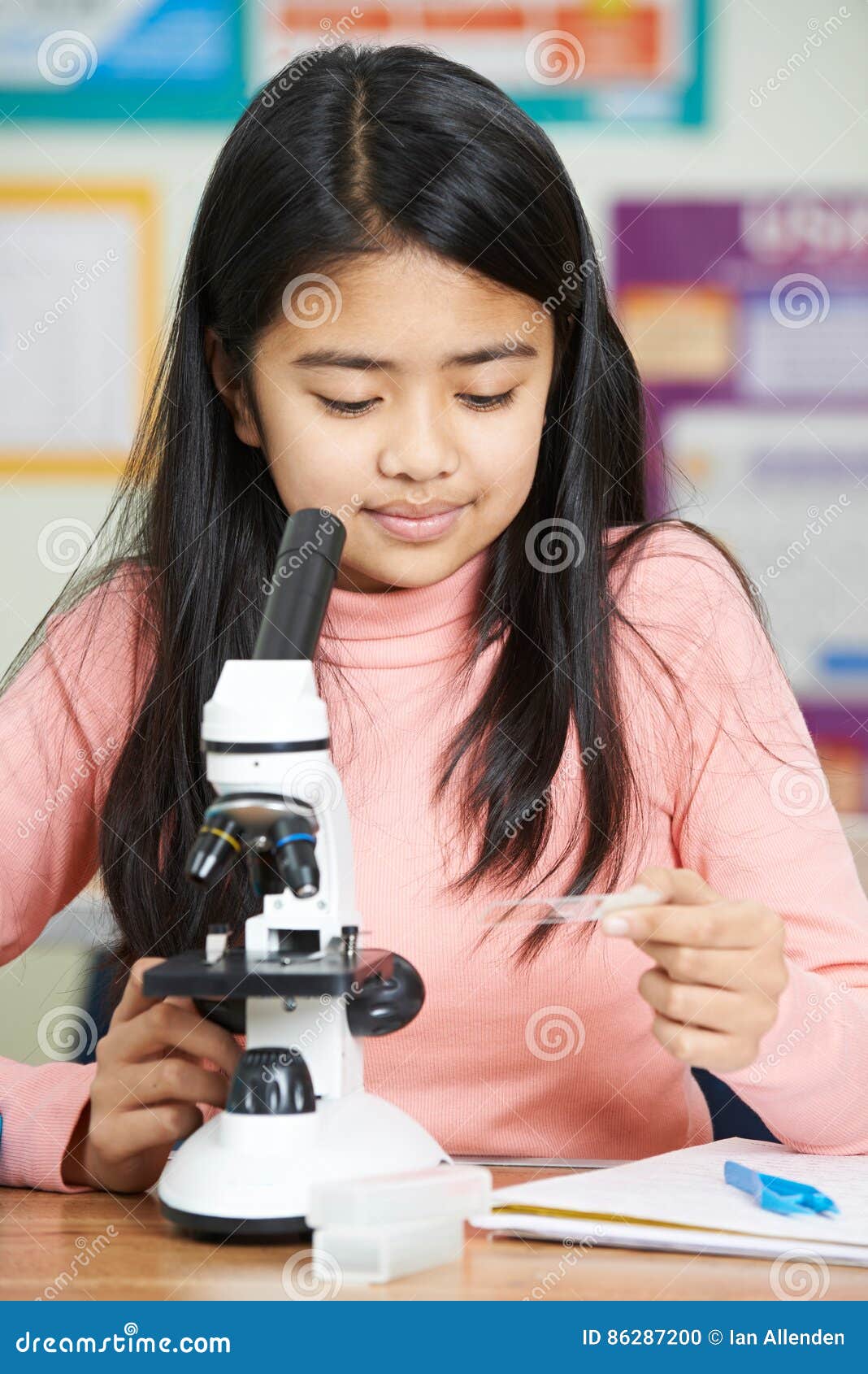 Female Student with Microscope in Science Class Stock Photo - Image of ...