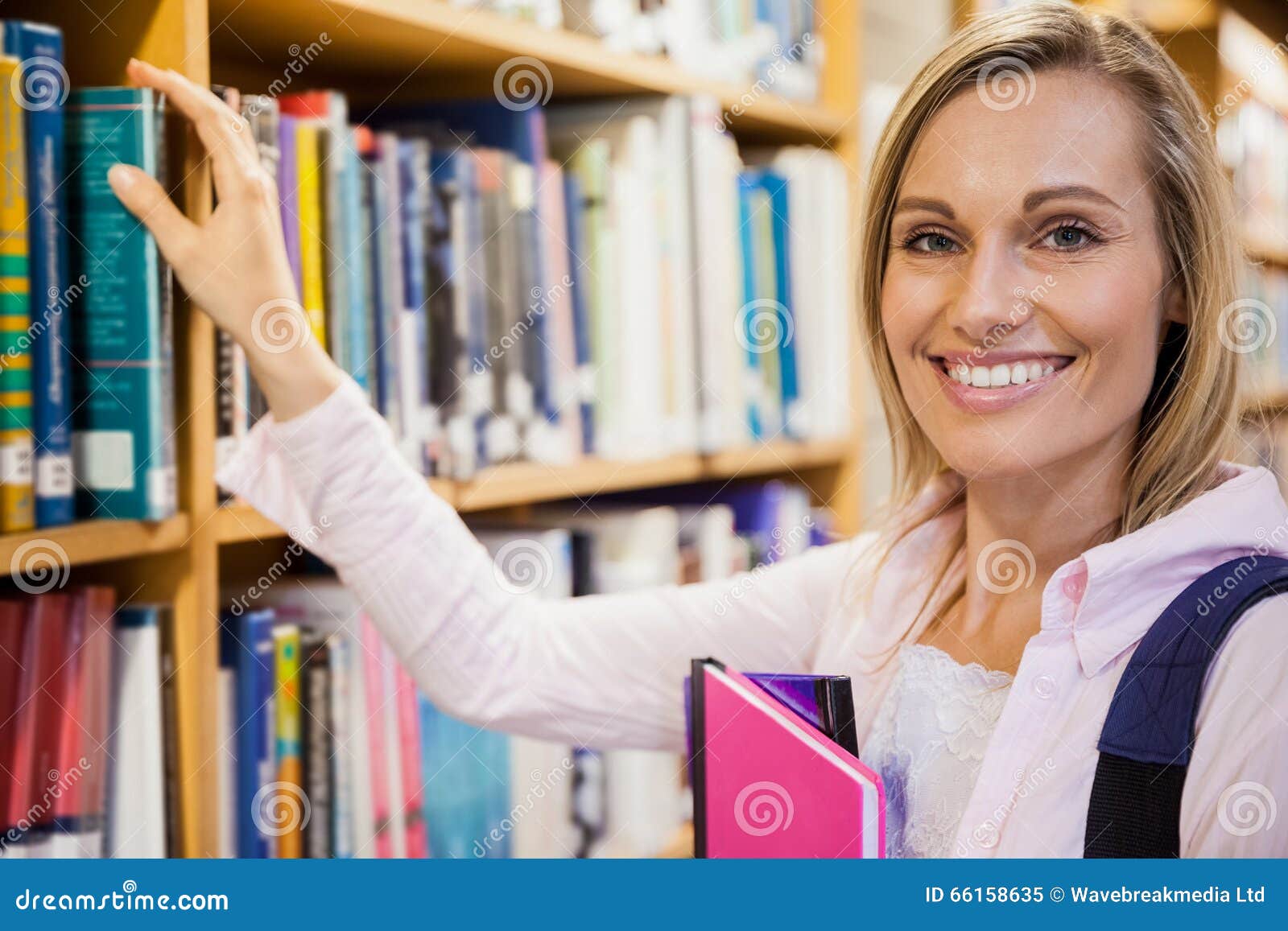 Female Student Picking a Book in the Library Stock Image - Image of ...