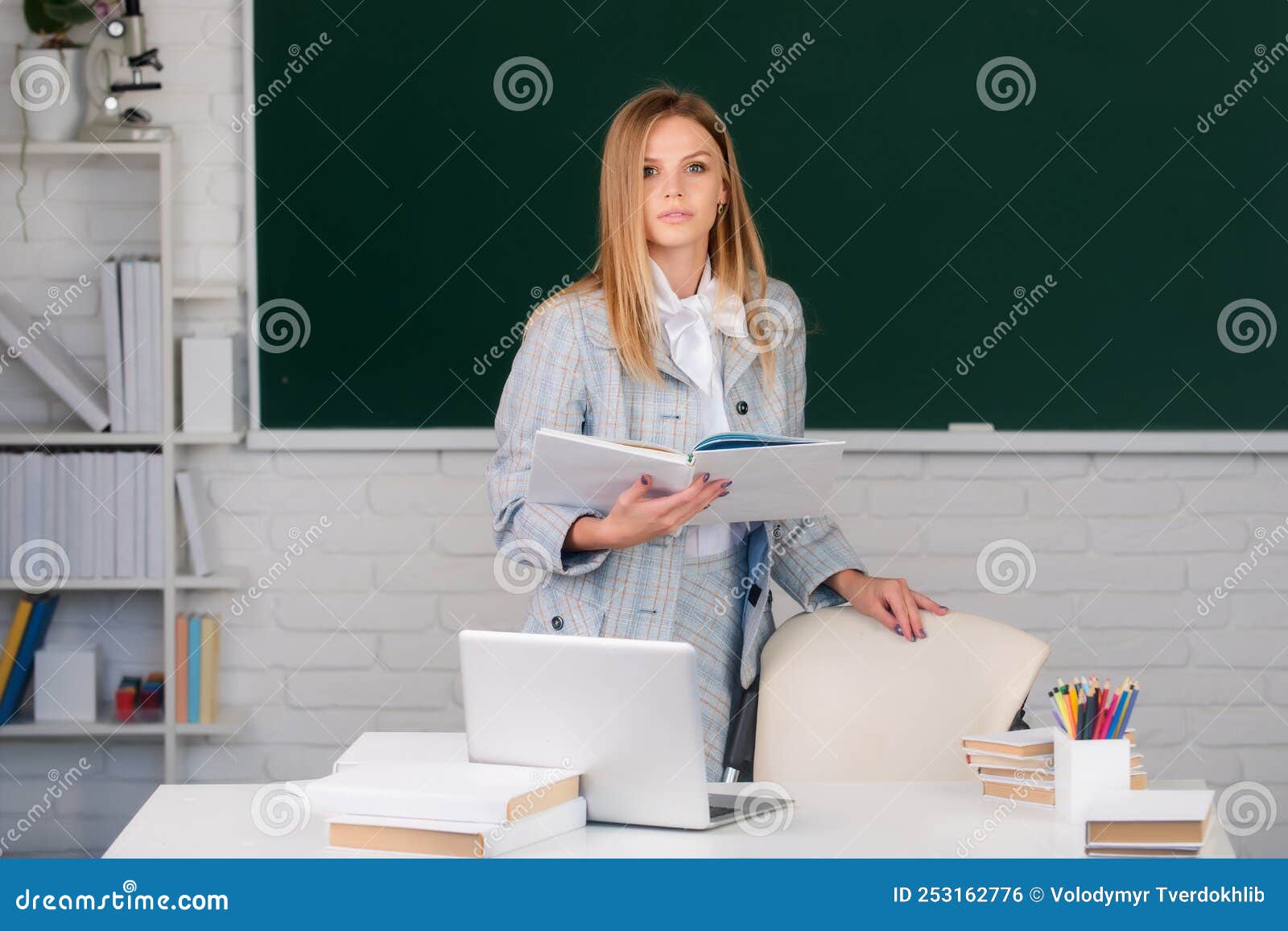Female Student Preparing Exam and Learning Lessons in School Classroom ...