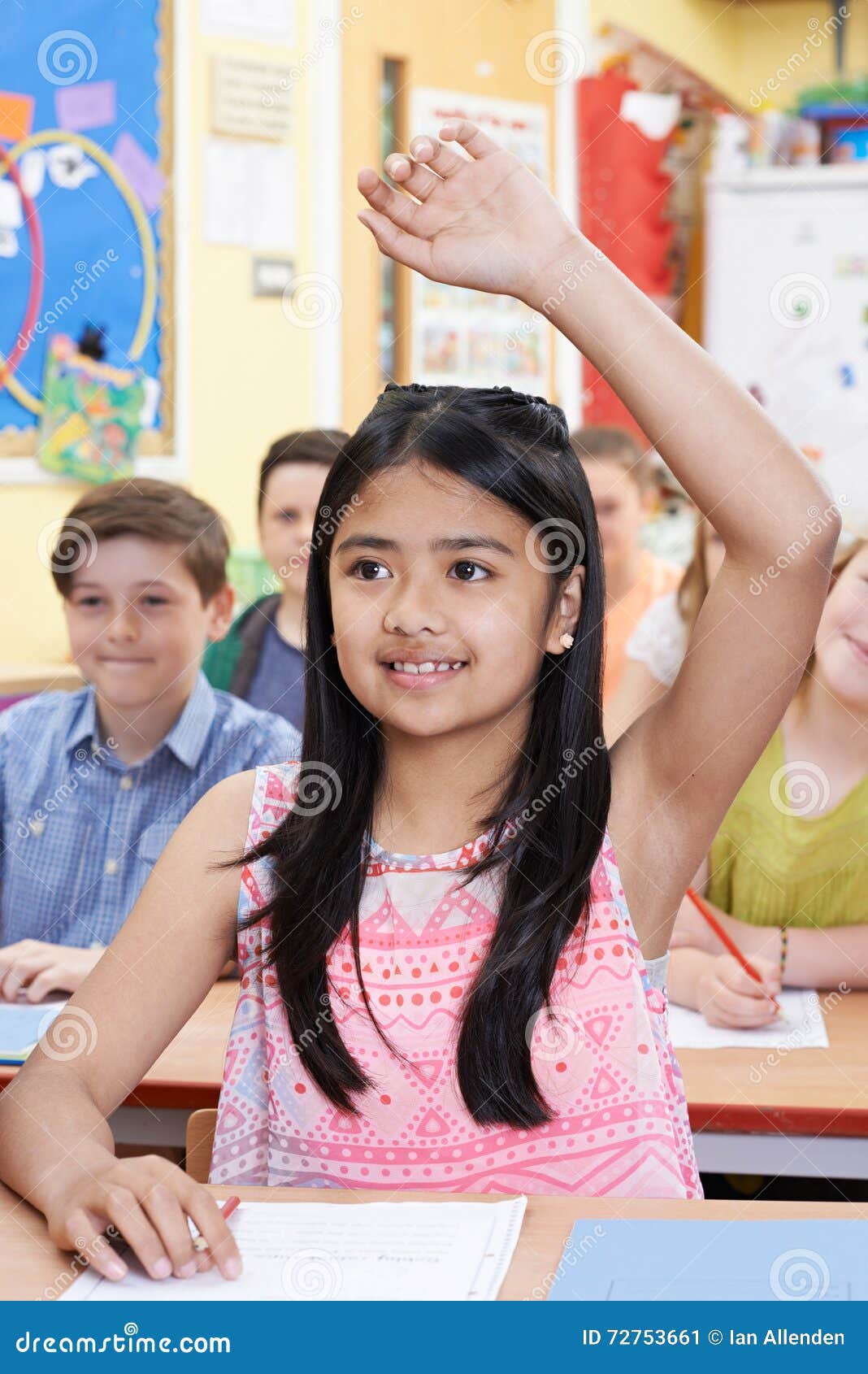 Female Student Raising Hand To Answer Question on Class Stock Image ...