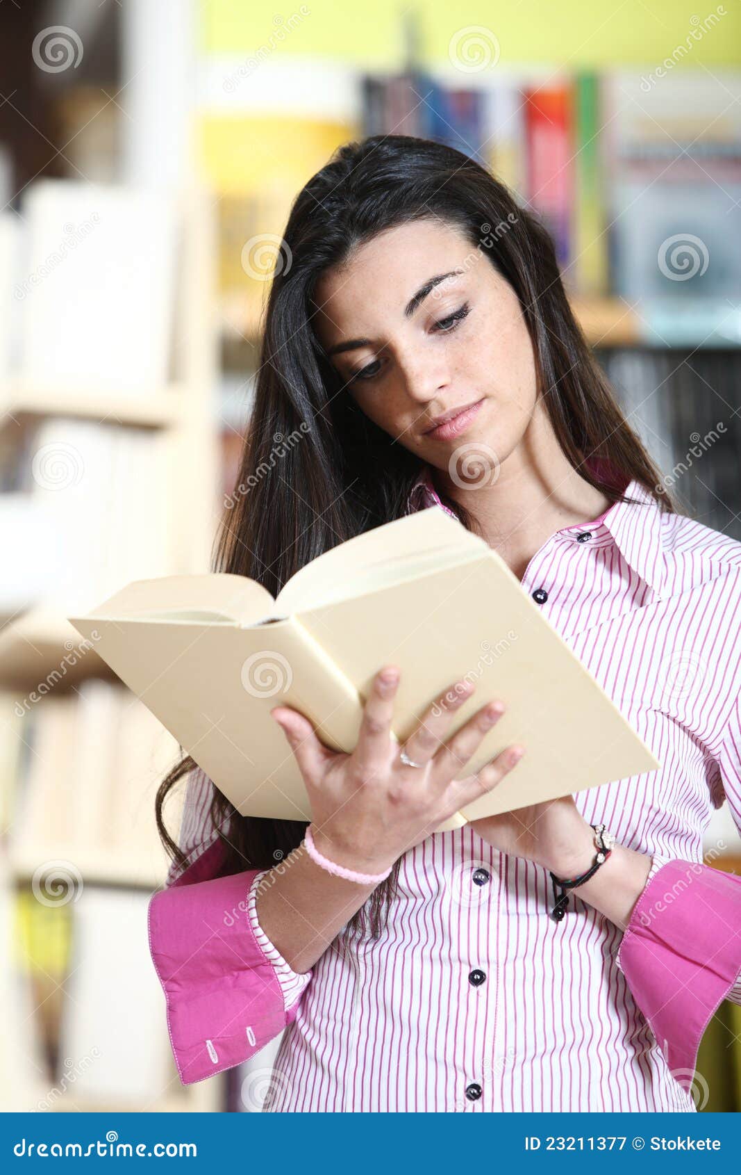 Female Student Reading a Book Stock Image - Image of bookstore, pretty ...